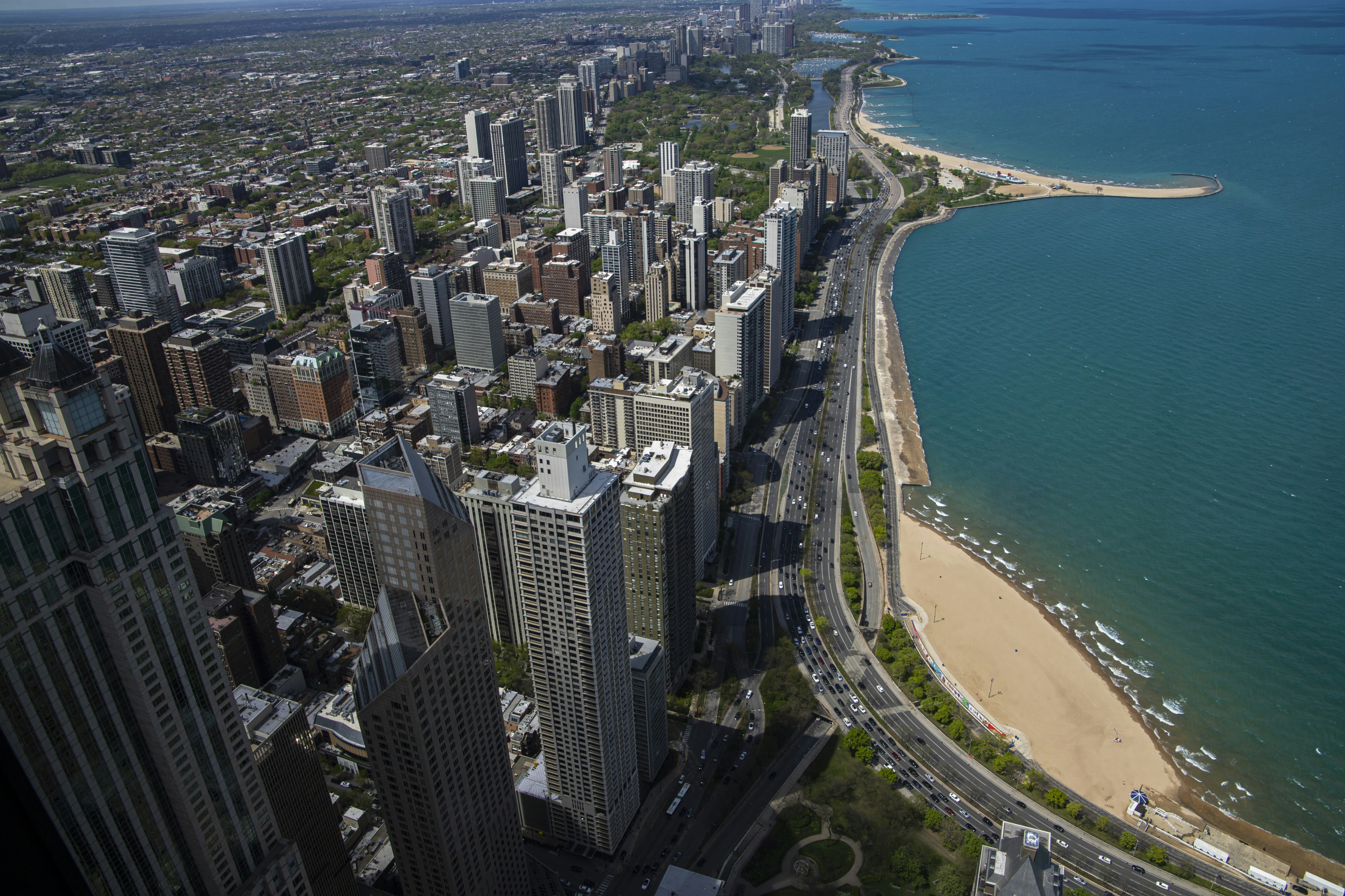 An aerial view of a city and the ocean photo – Free Sears tower Image ...