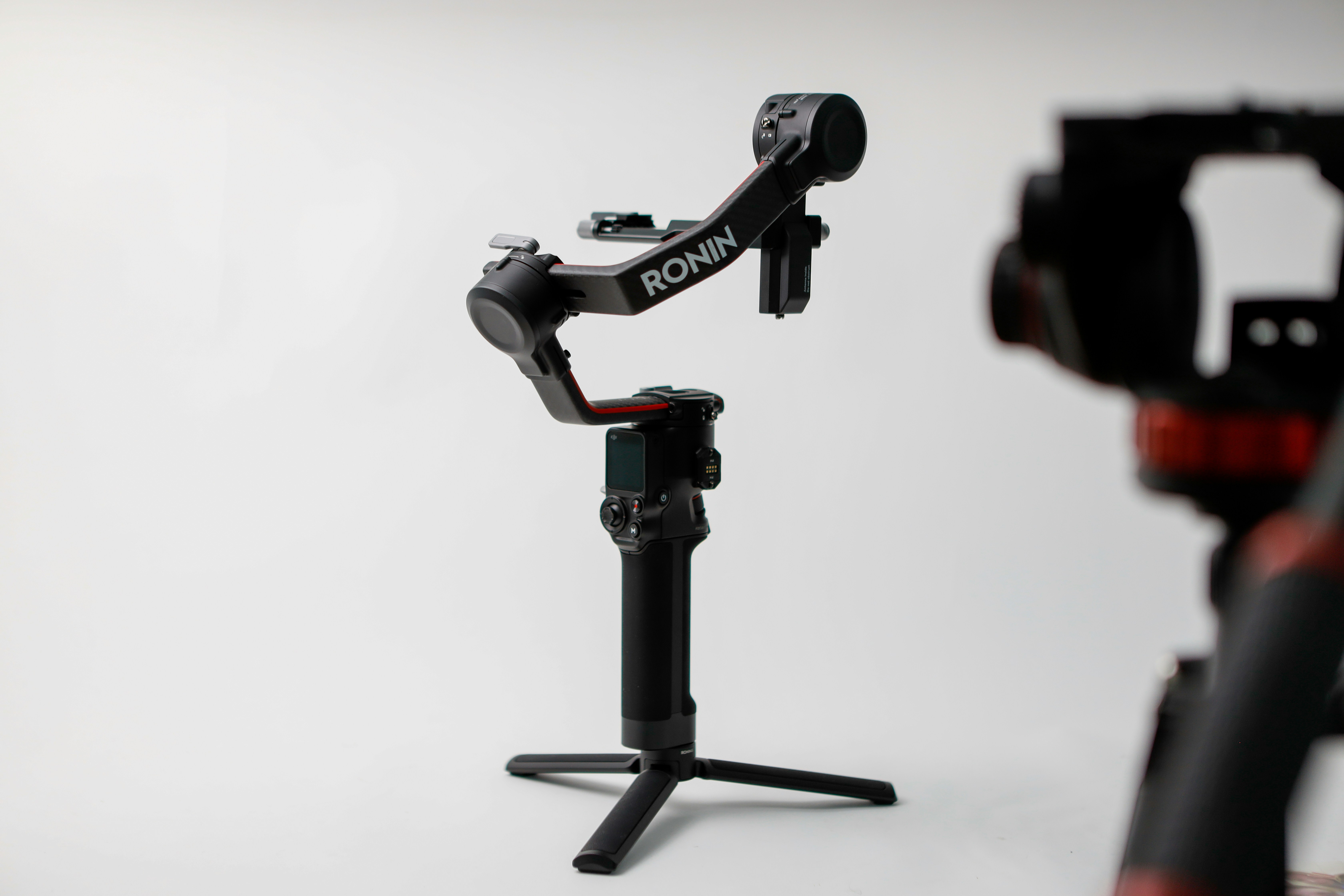 RONIN stabilizer showcased on a minimalist backdrop, highlighting its design and functionality for smooth filming.