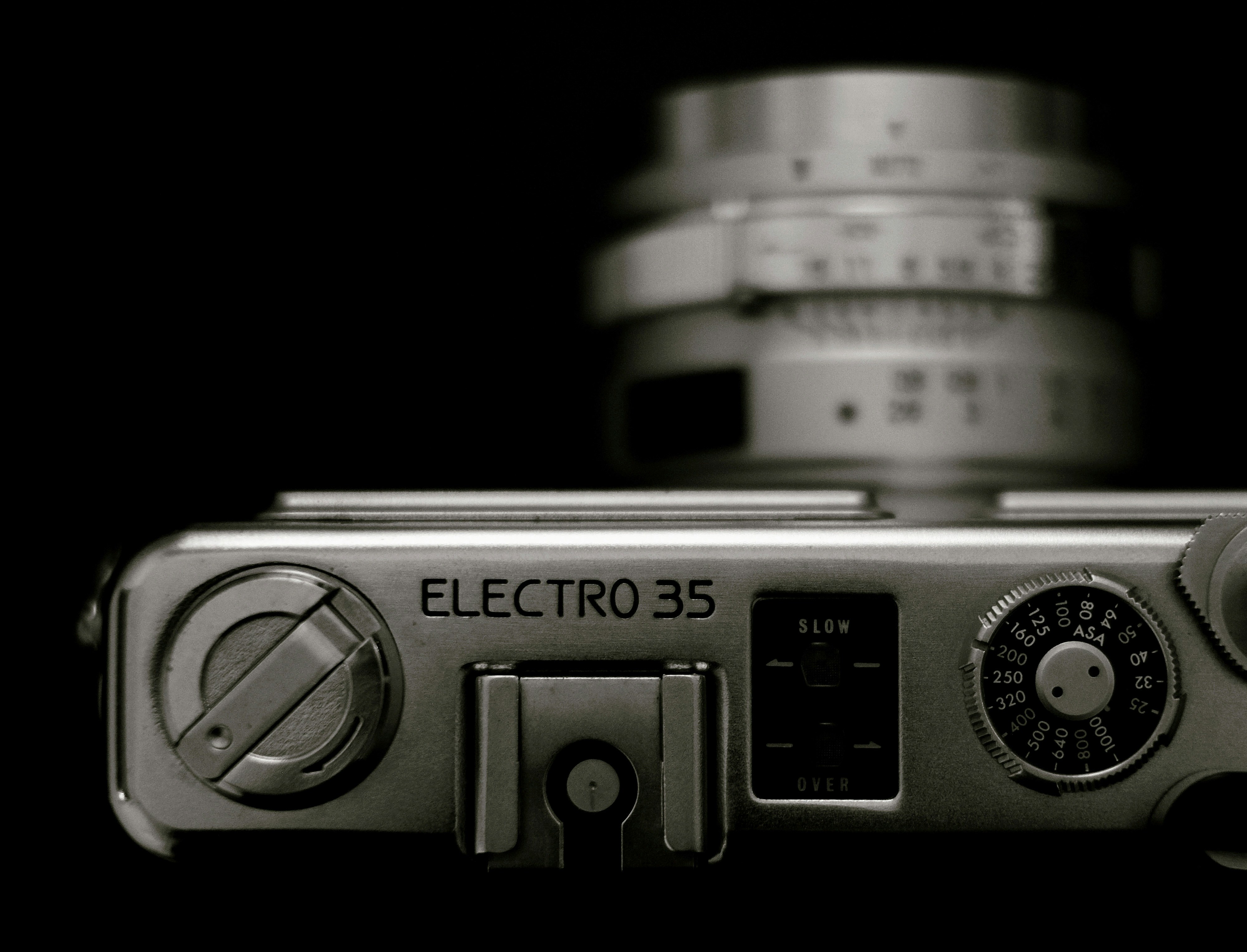 Close-up of a vintage Electro 35 camera showcasing its dials and controls on a dark background.
