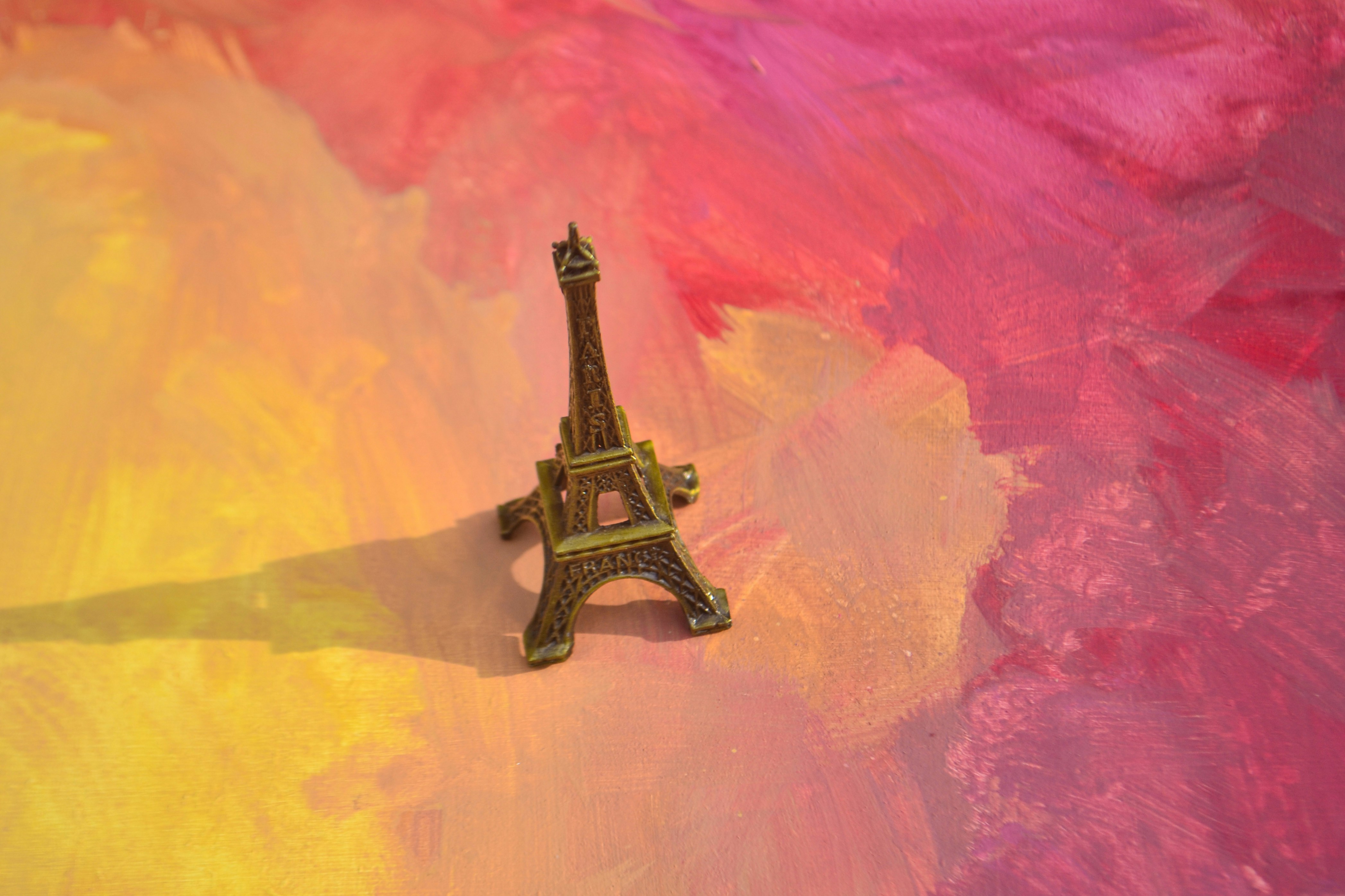 a miniature eiffel tower sitting on top of a table