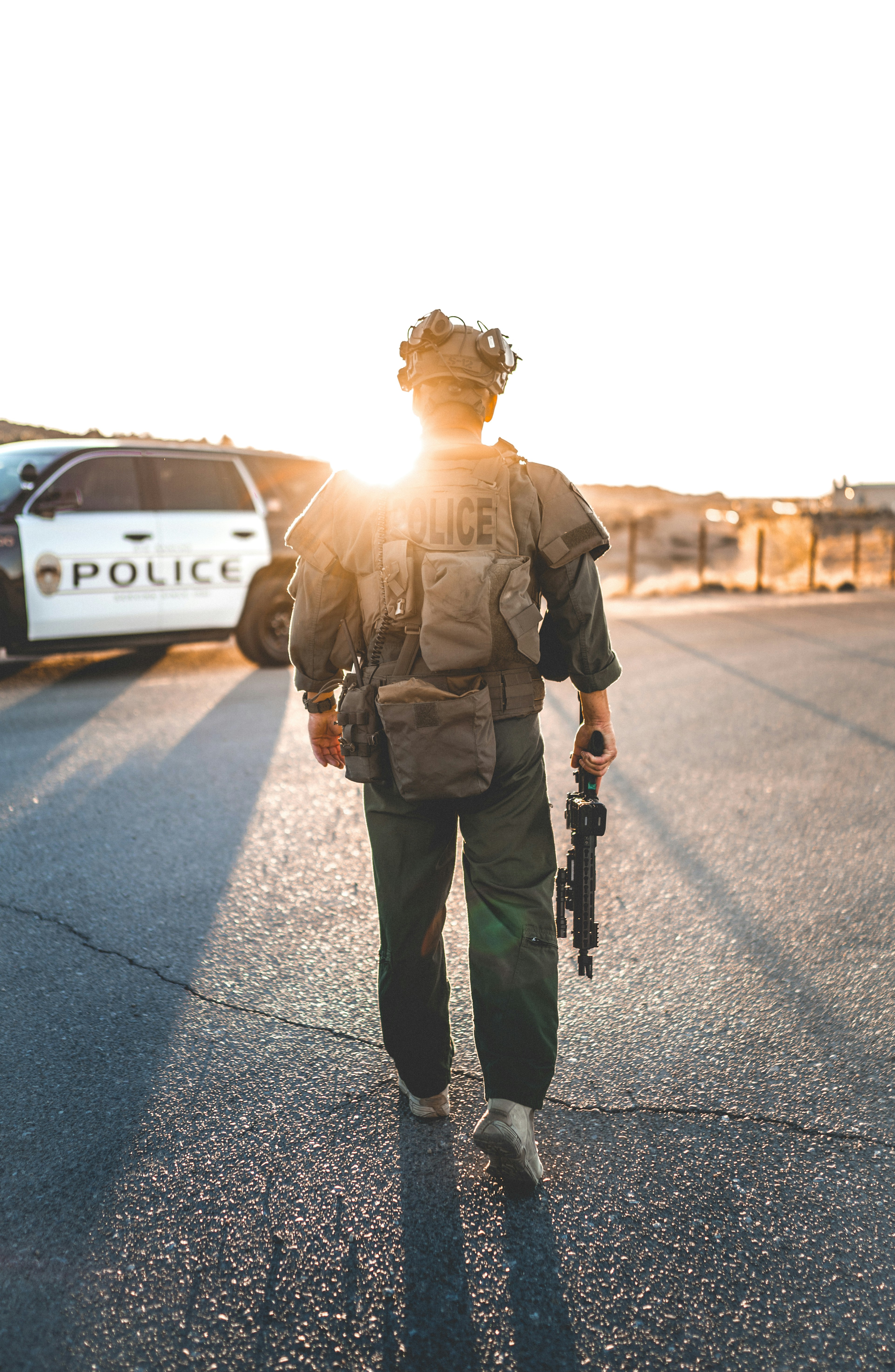 A police officer walking down the street photo – Free New mexico Image ...