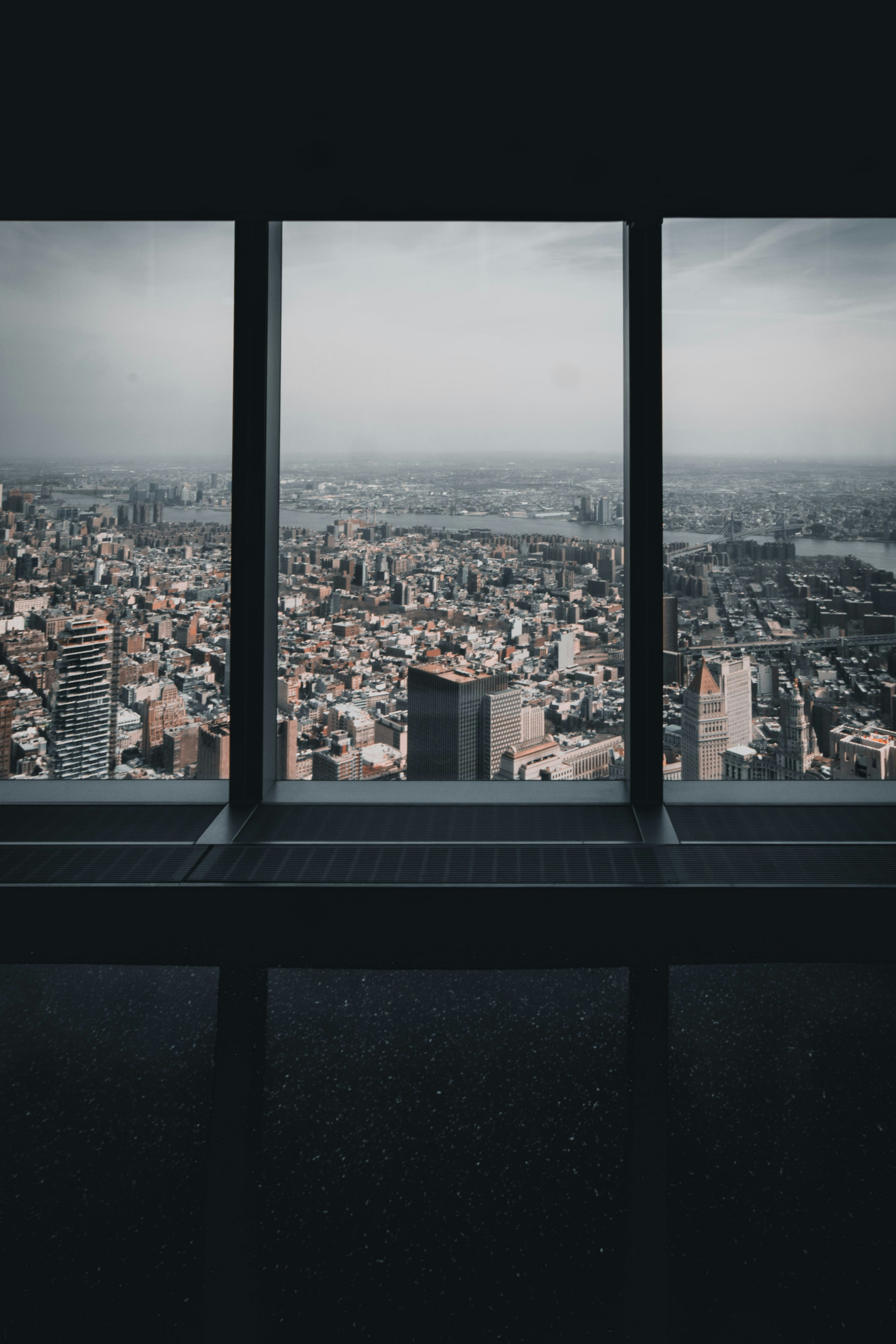 A large window with a view of a city photo – Free Grey Image on Unsplash