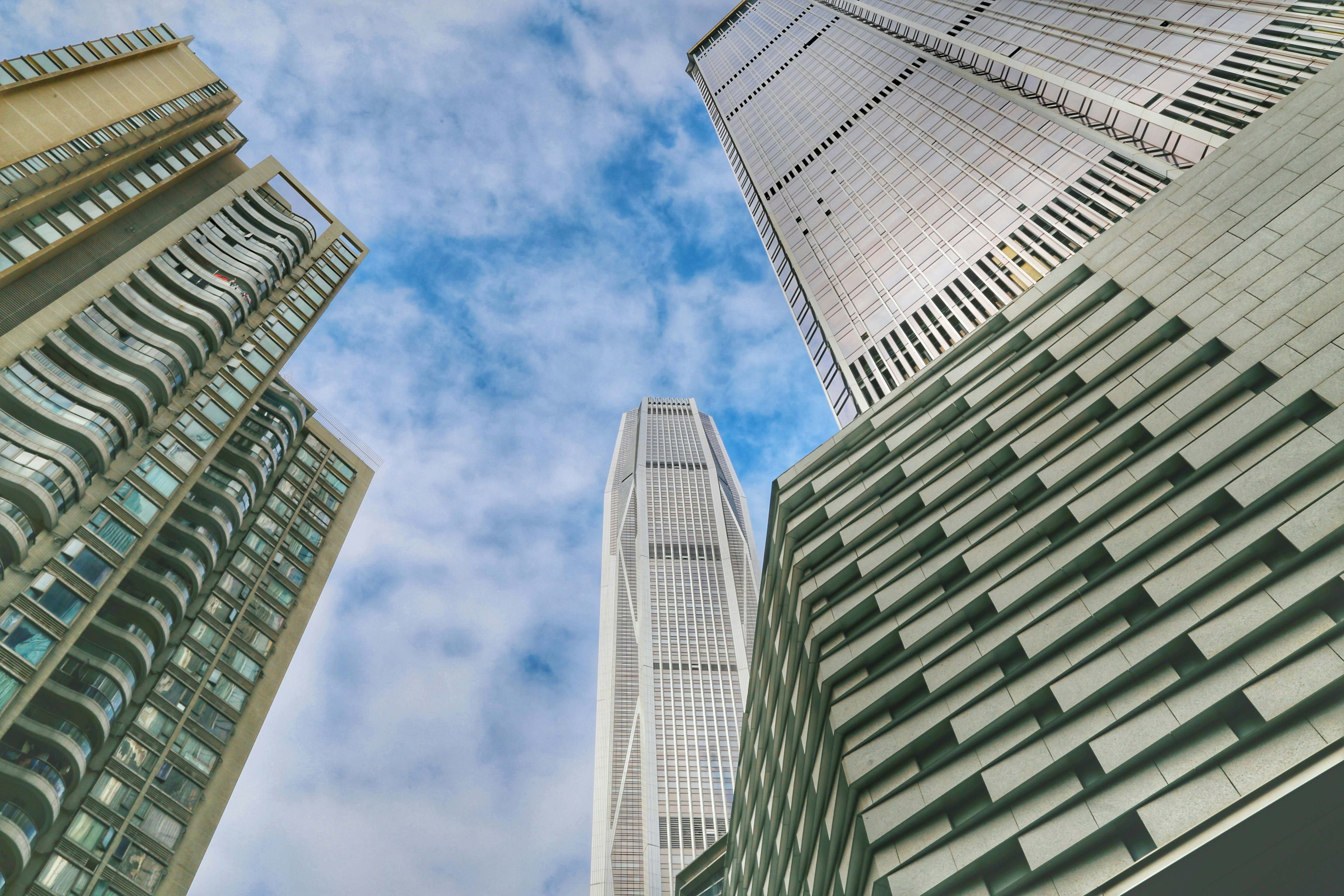A couple of tall buildings sitting next to each other photo – Free 中国 ...