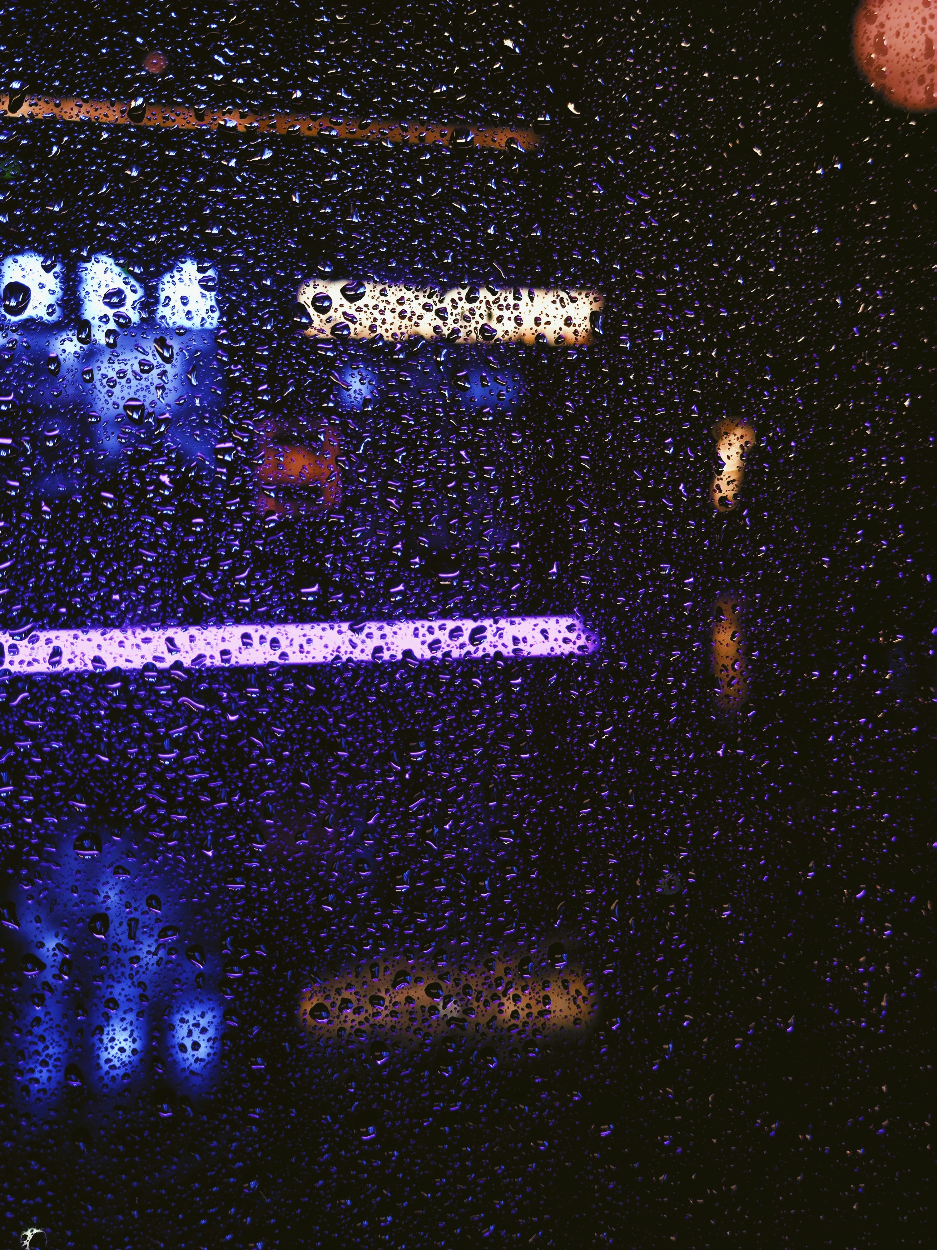 Neon Rain on a Glass Facade