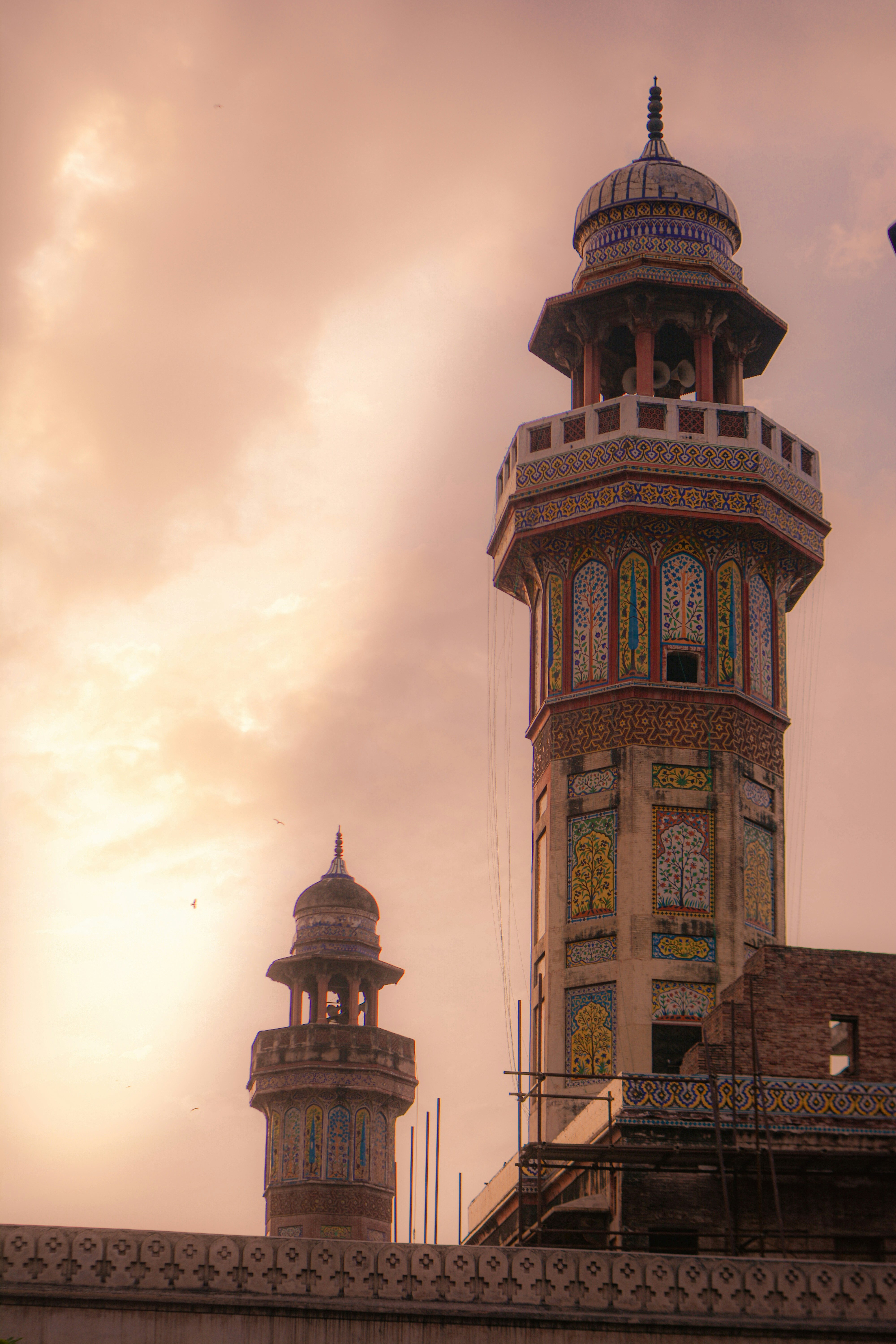 a tall tower with a clock on the top of it