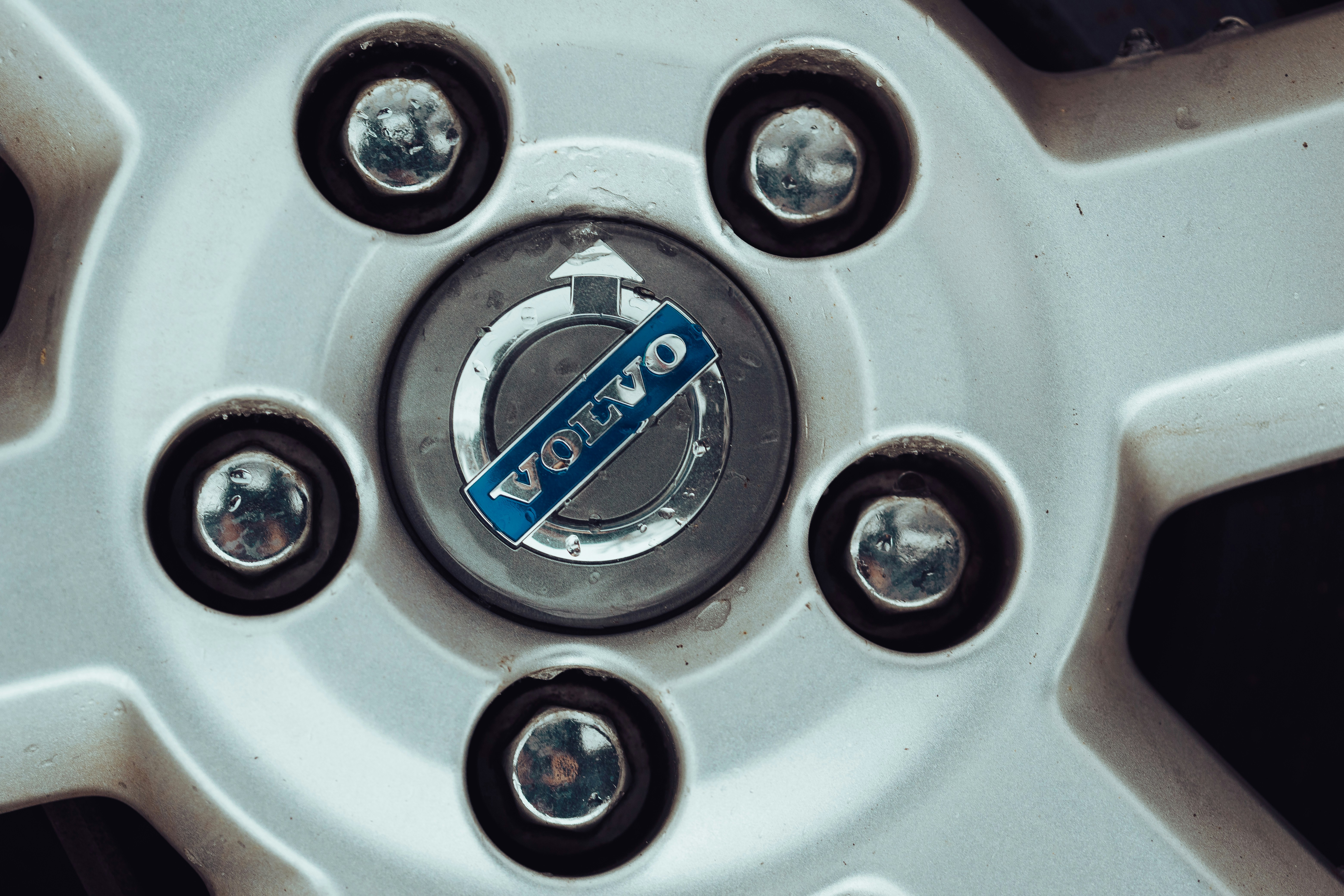 Centered Emblem: A Volvo Wheel Cap Dominating the Frame
