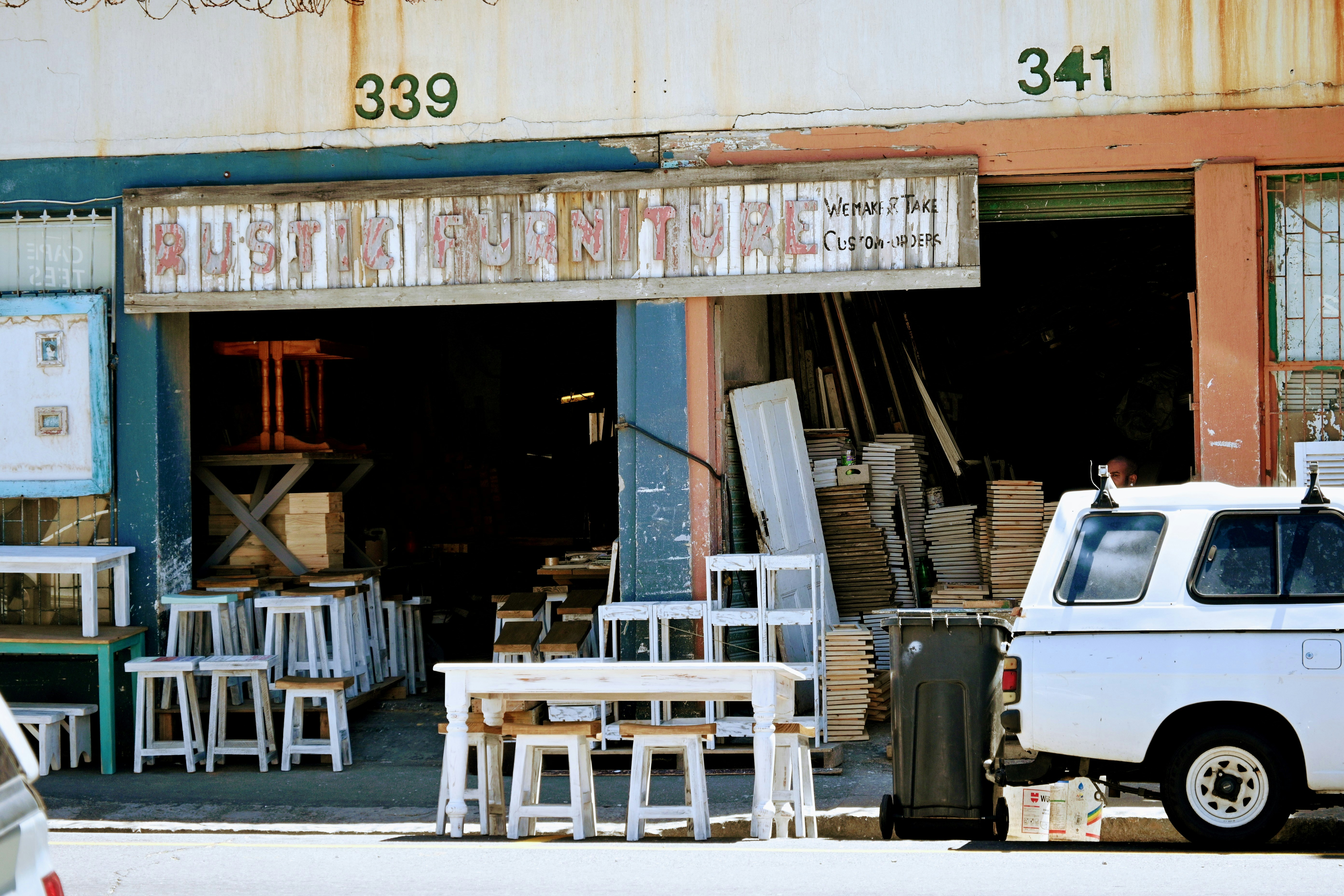 a white truck parked in front of a building