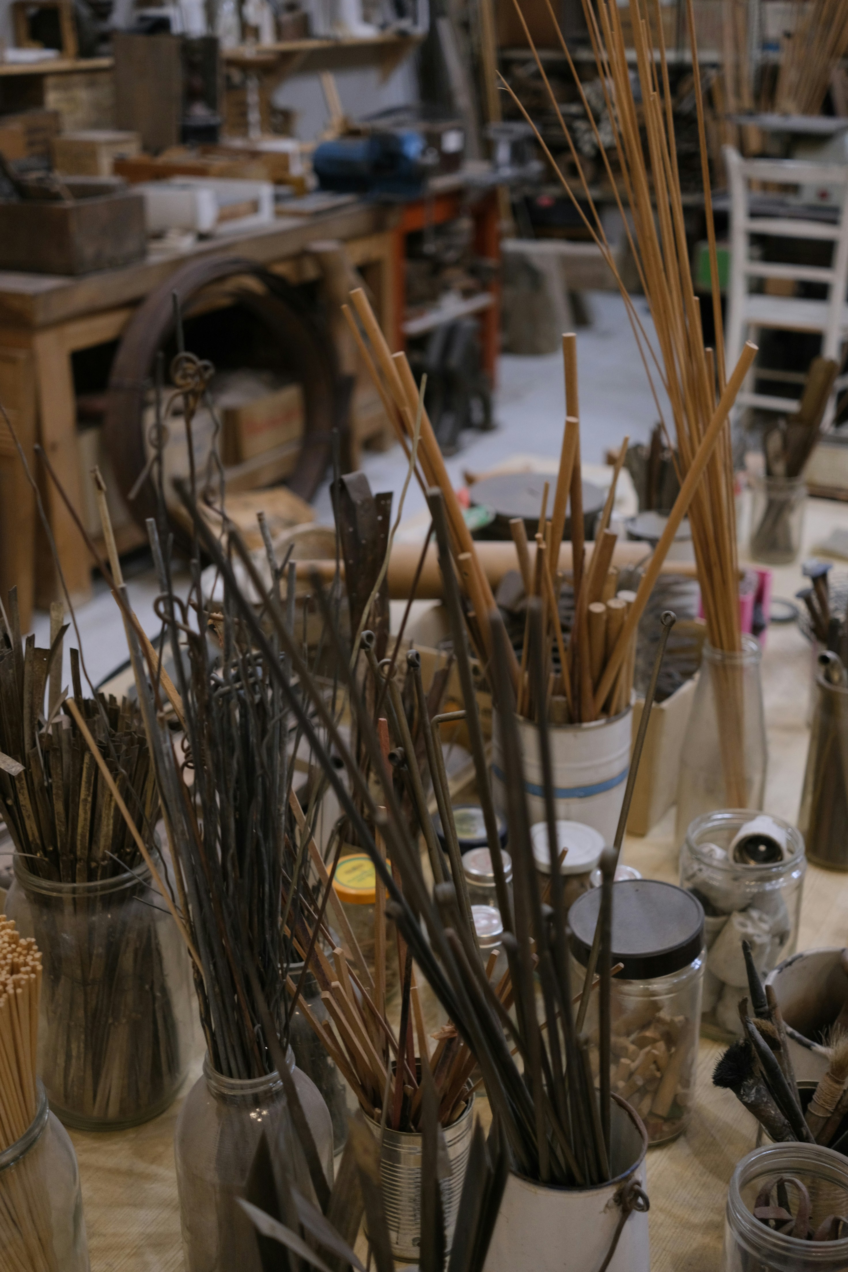 A group of vases filled with lots of sticks photo – Free Prague Image ...