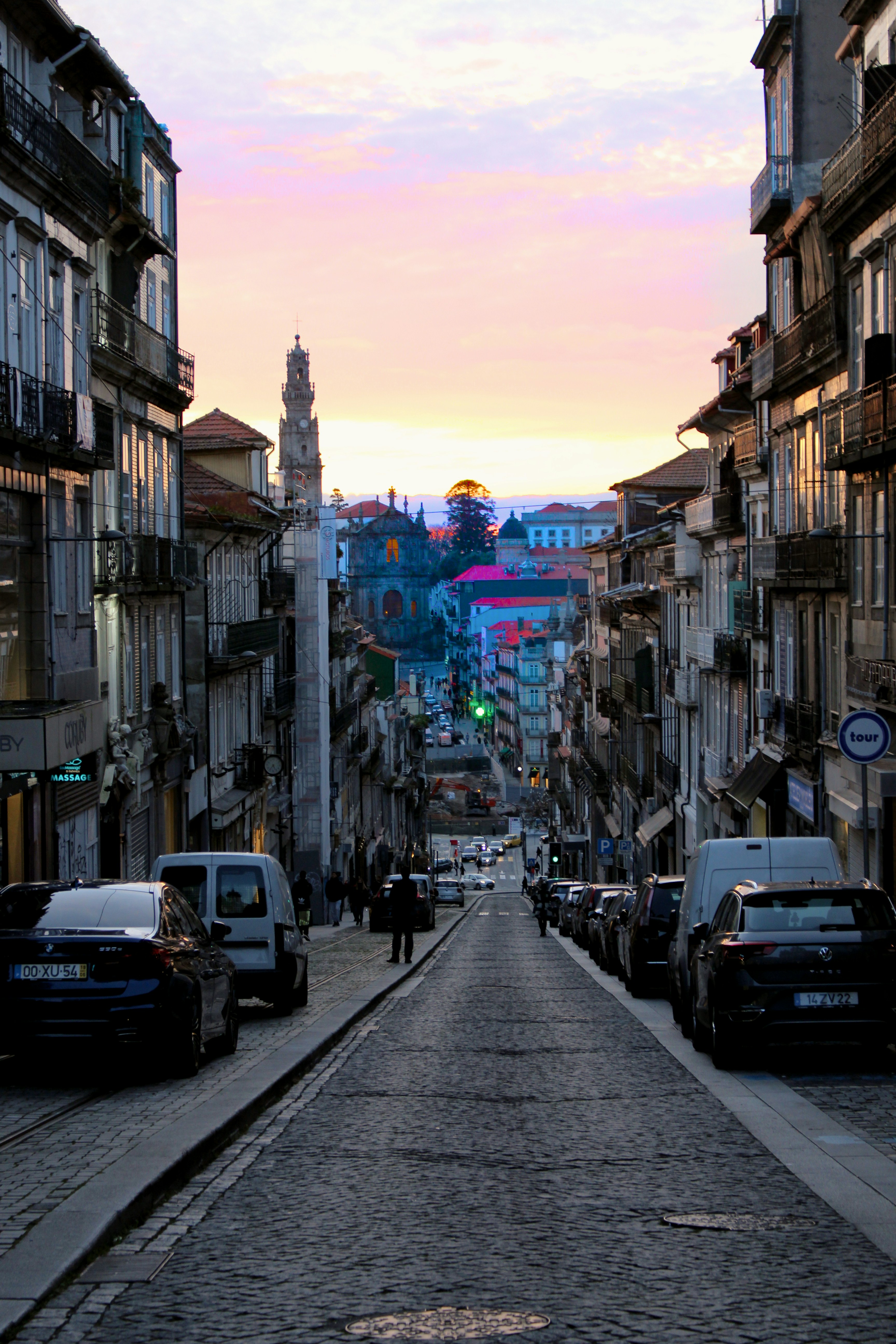Cobbled Corridor Toward the Bell Tower at Sunset