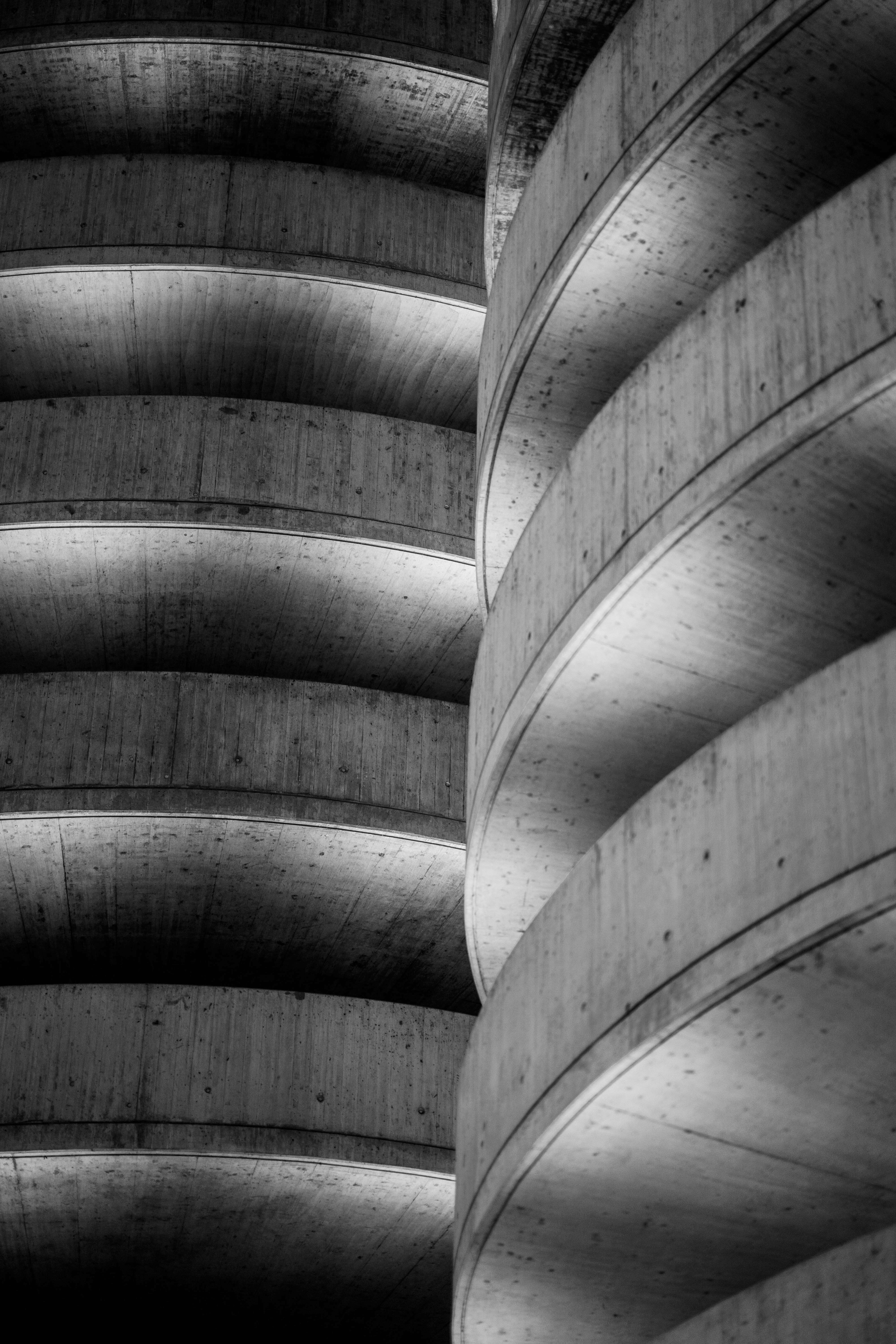 Vertical Spiral of Concrete: Monochrome Geometry in Curved Ramps