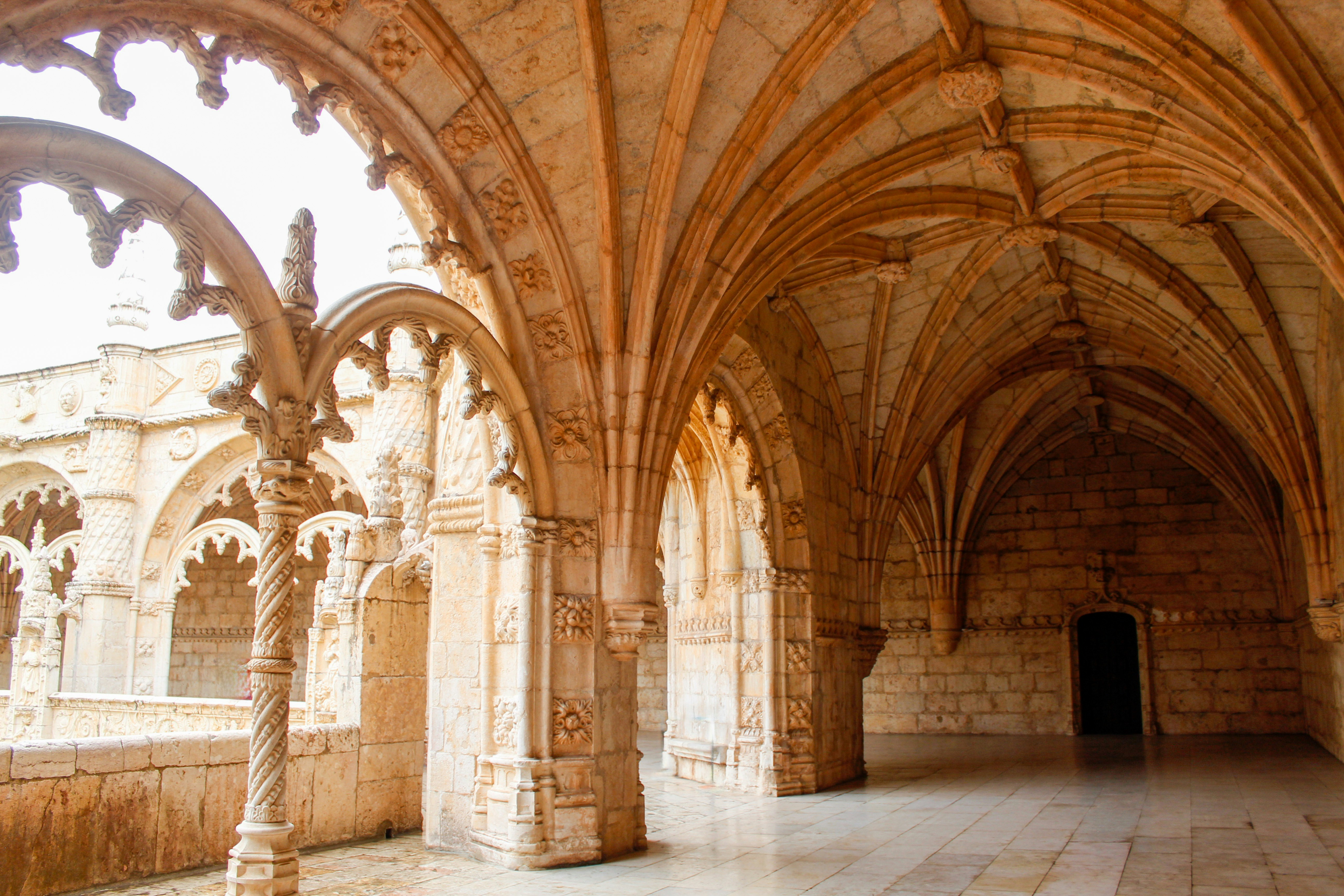 A large stone building with arches and pillars photo – Free ...