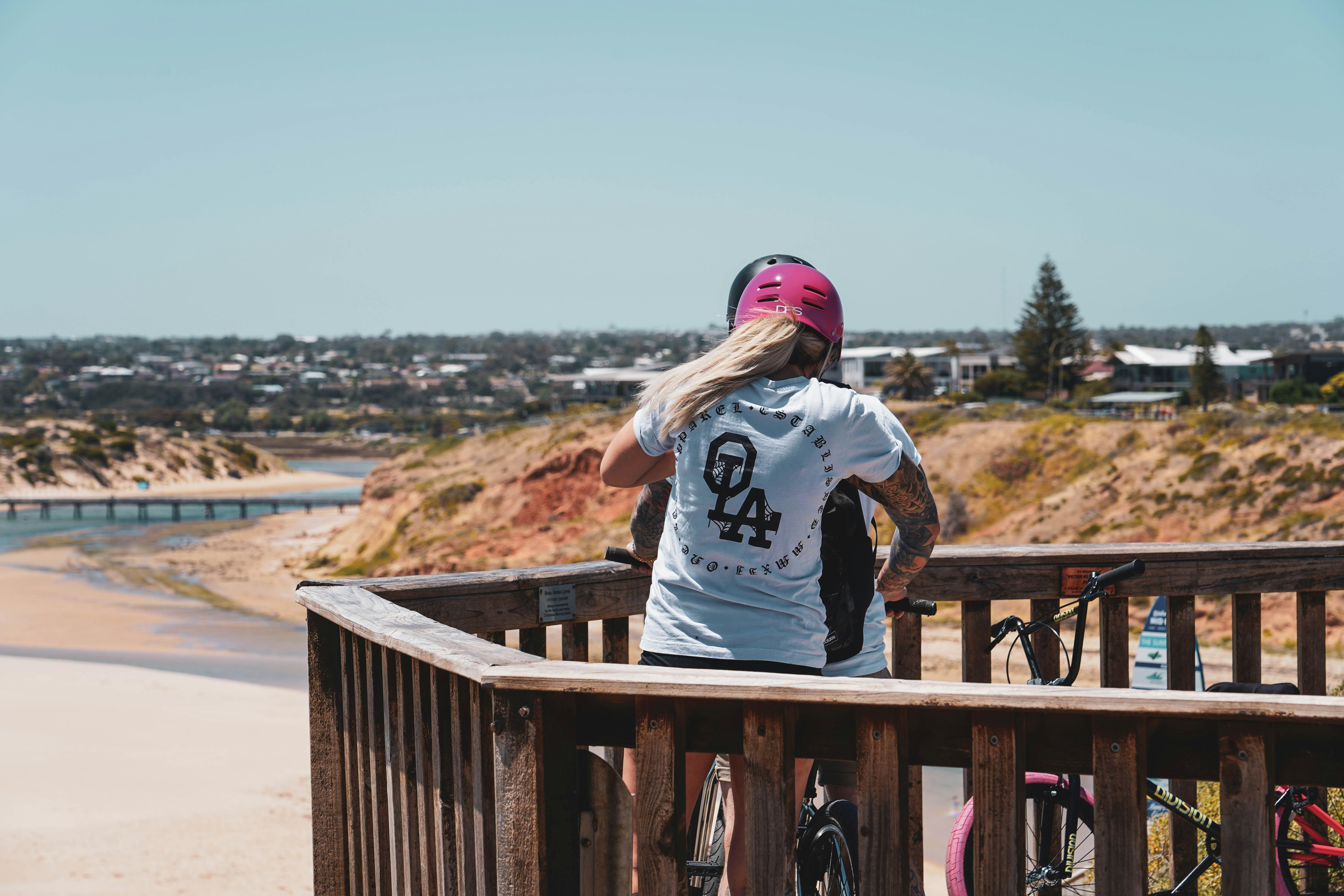 Biker at the Viewing Deck: Pink Helmet, Quiet Coast