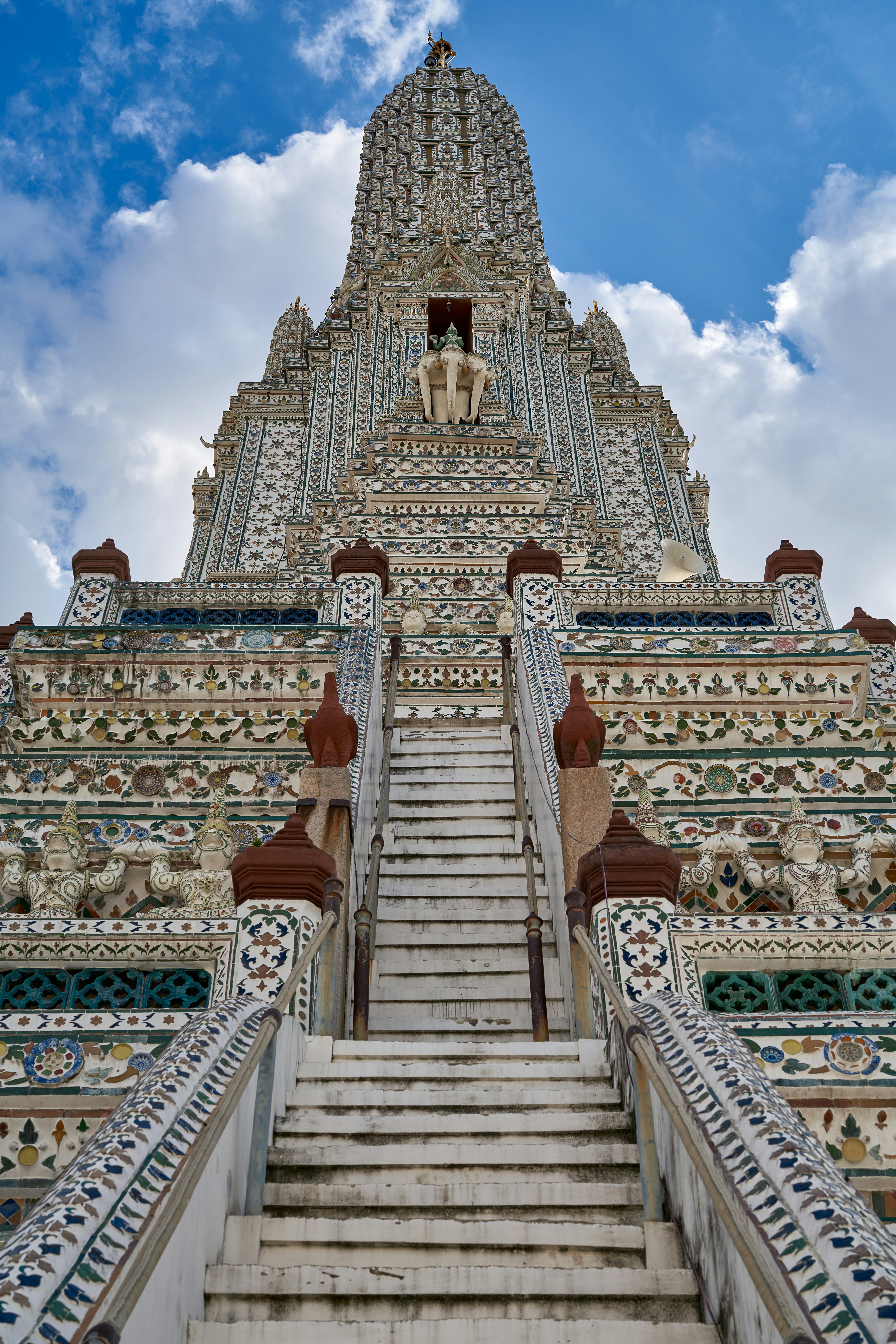 Staircase to the Summit: Ornate Temple Facade Reaches Toward the Sky
