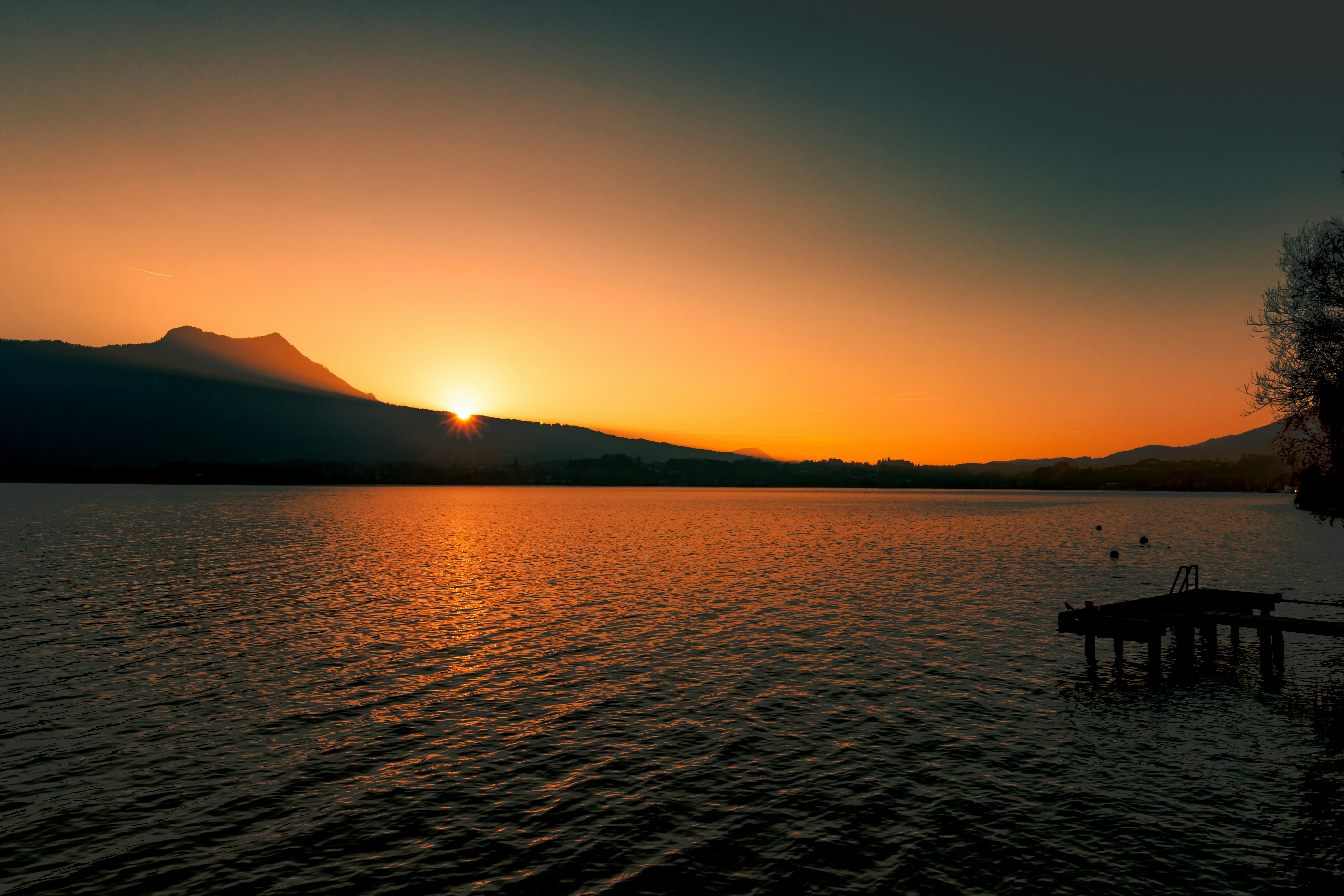 Horizon Ember over Stillwater: Sunset Paints the Lake