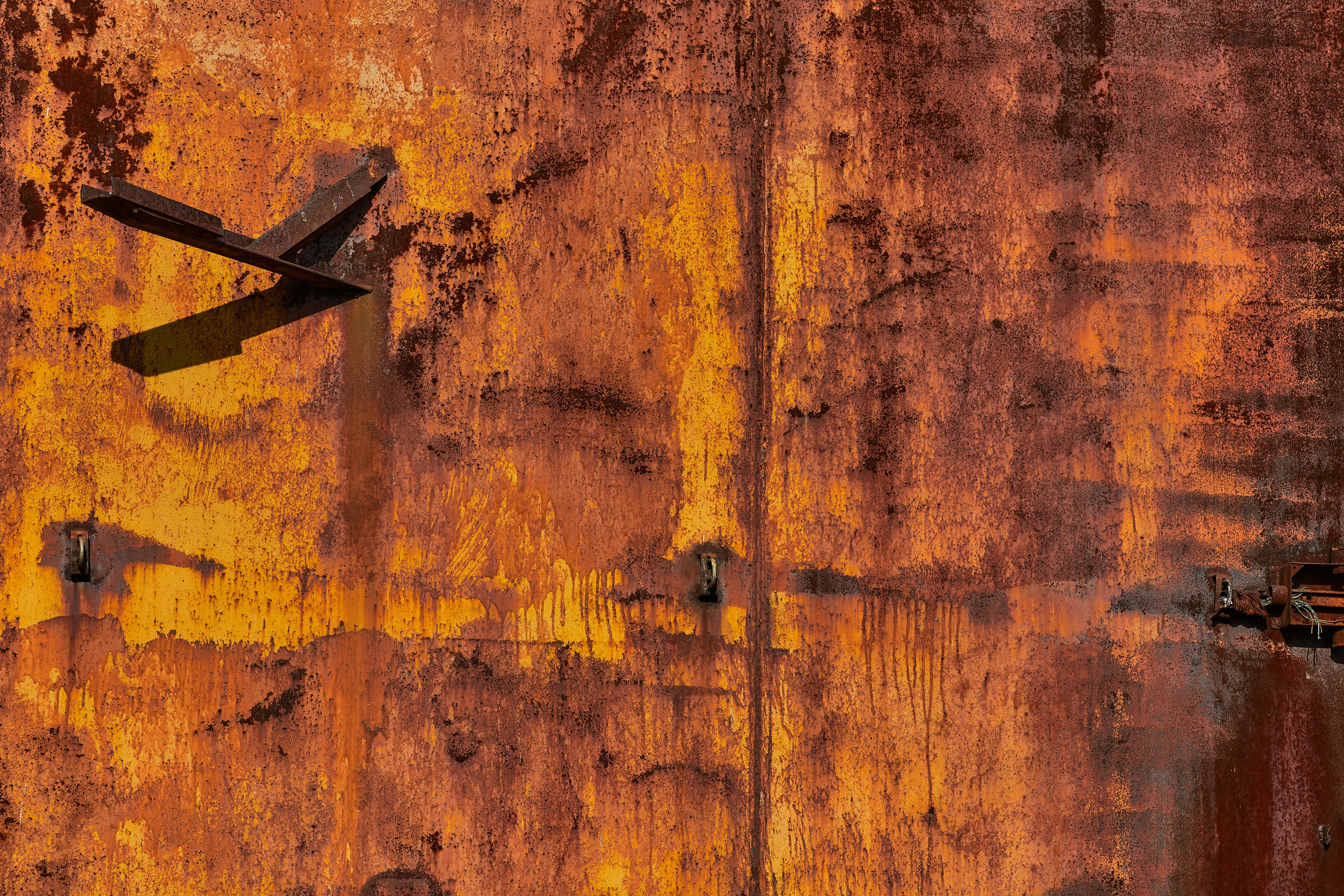X-Form on a Rusted Canvas: Patina and Steel in Quiet Light