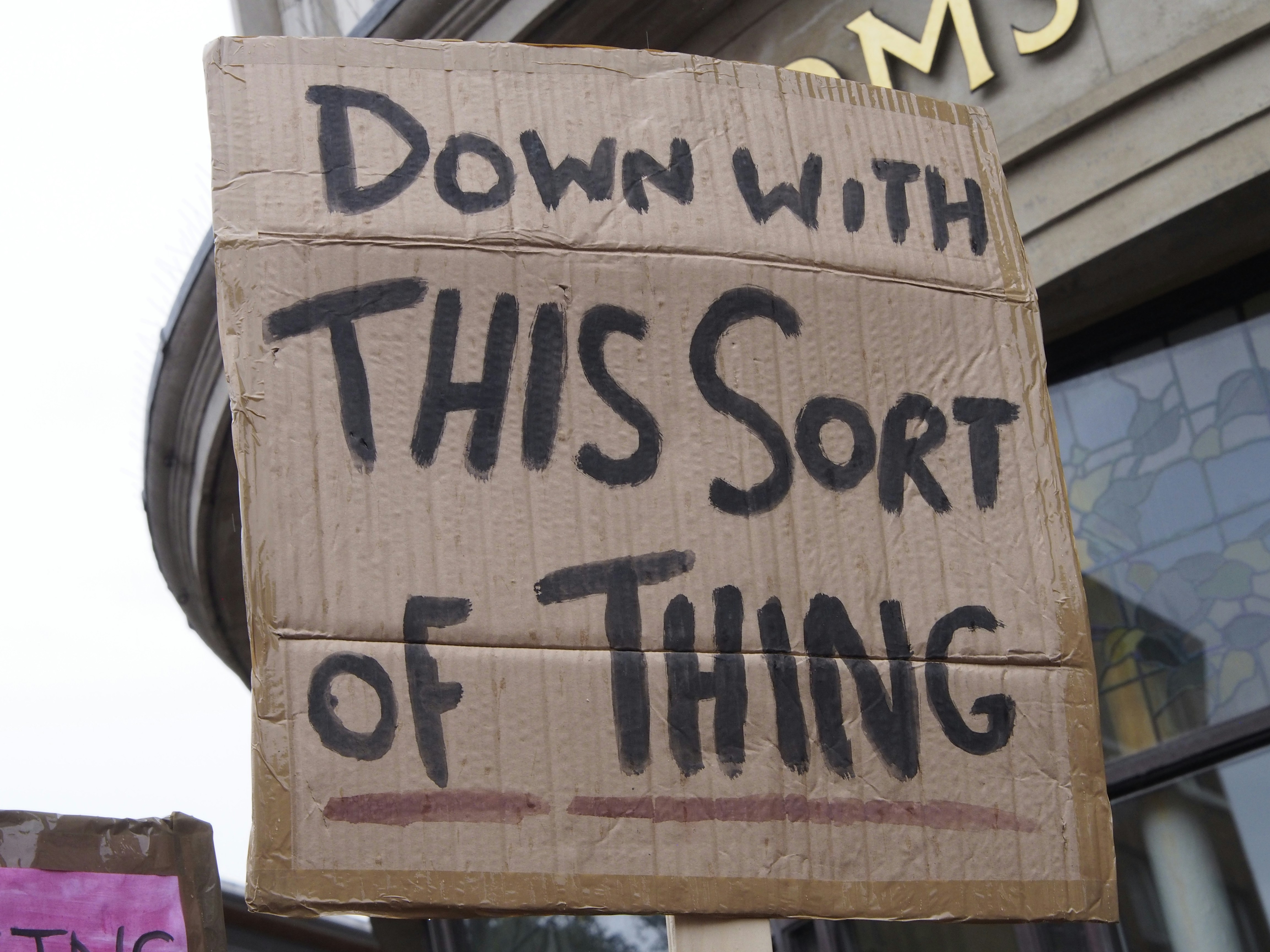 A cardboard sign that says down with this sort of thing photo – Free ...