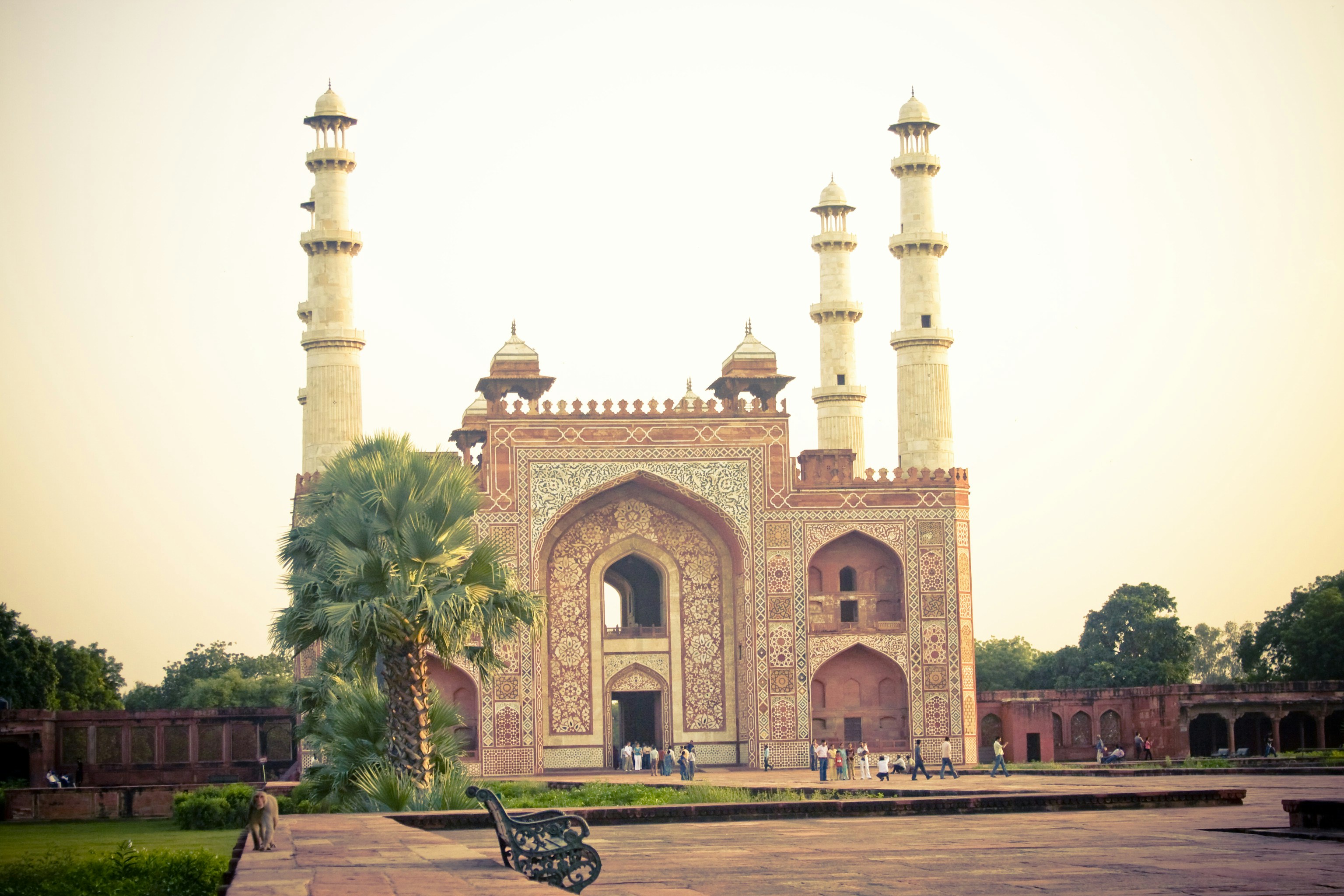 A bench sitting in front of a tall building photo – Free Taj mahal ...