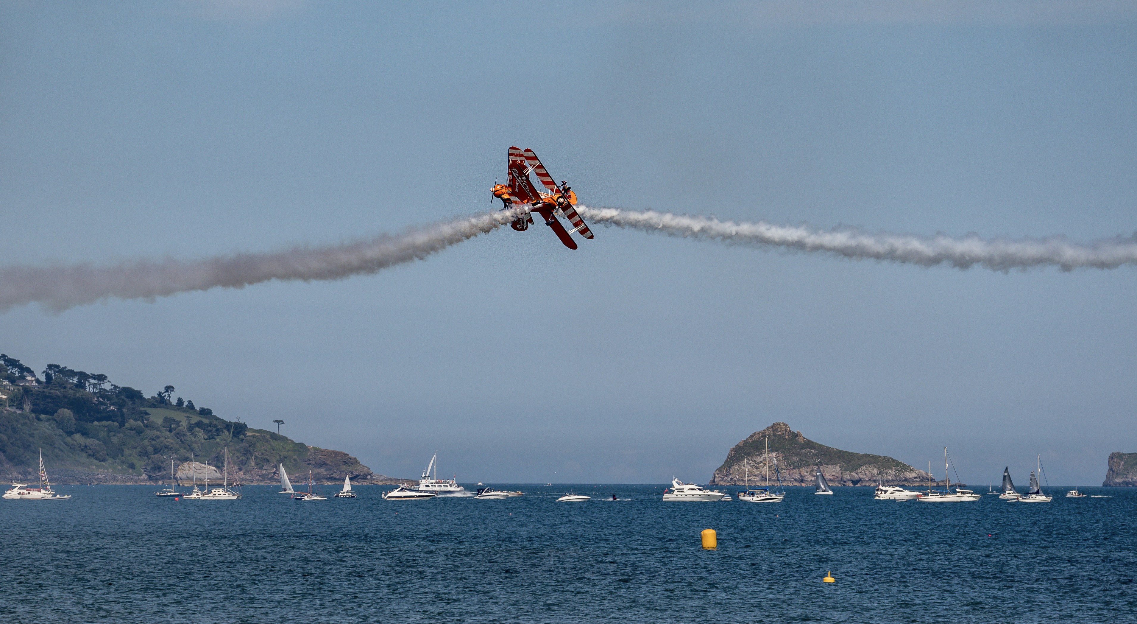 A small plane flying over a body of water photo – Free Torbay Image on ...