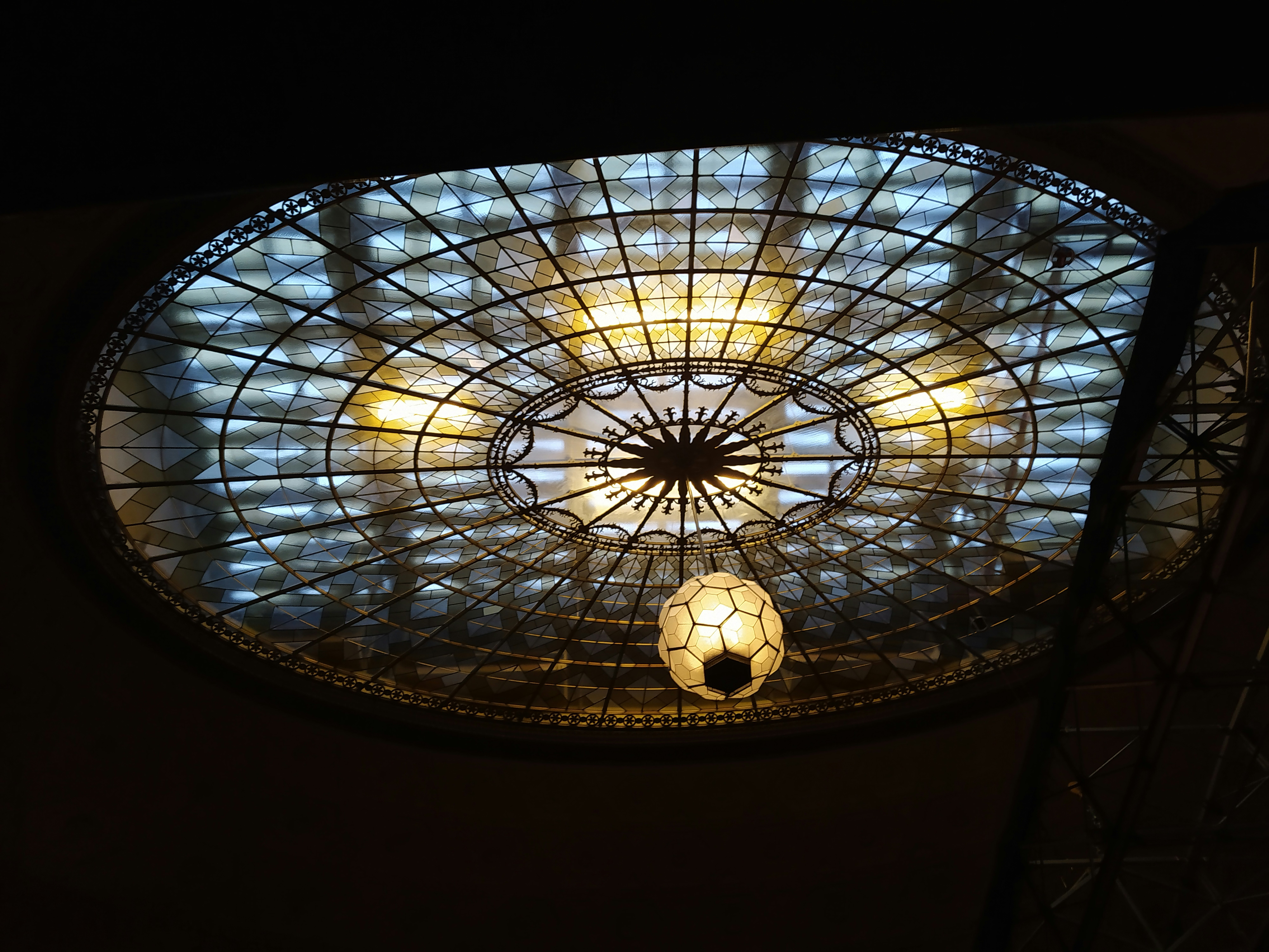 A round stained glass window with a soccer ball on it photo – Free ...
