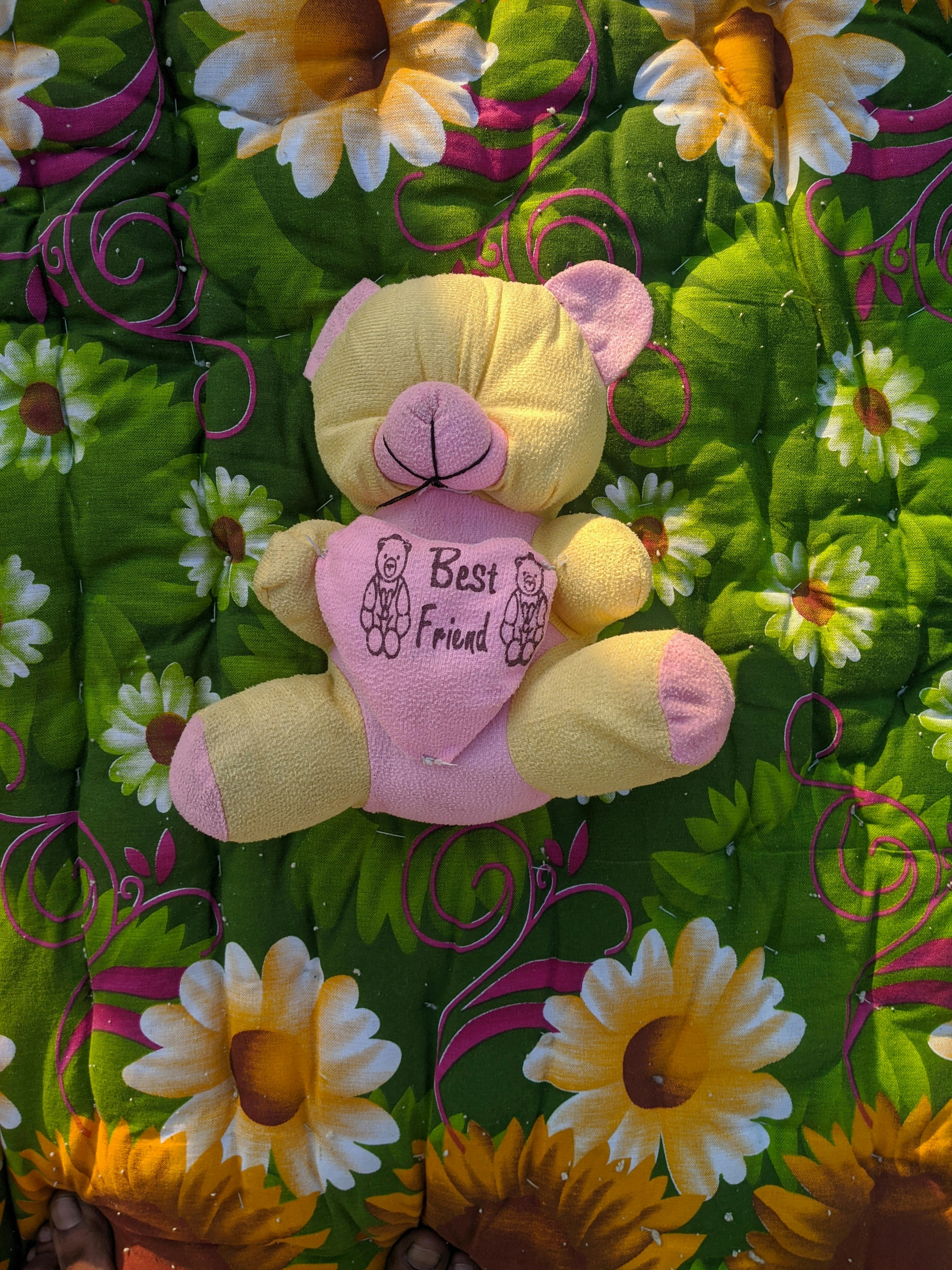 Soft Pink Bear on a Daisy Quilt: Centerstage with Floral Backdrop