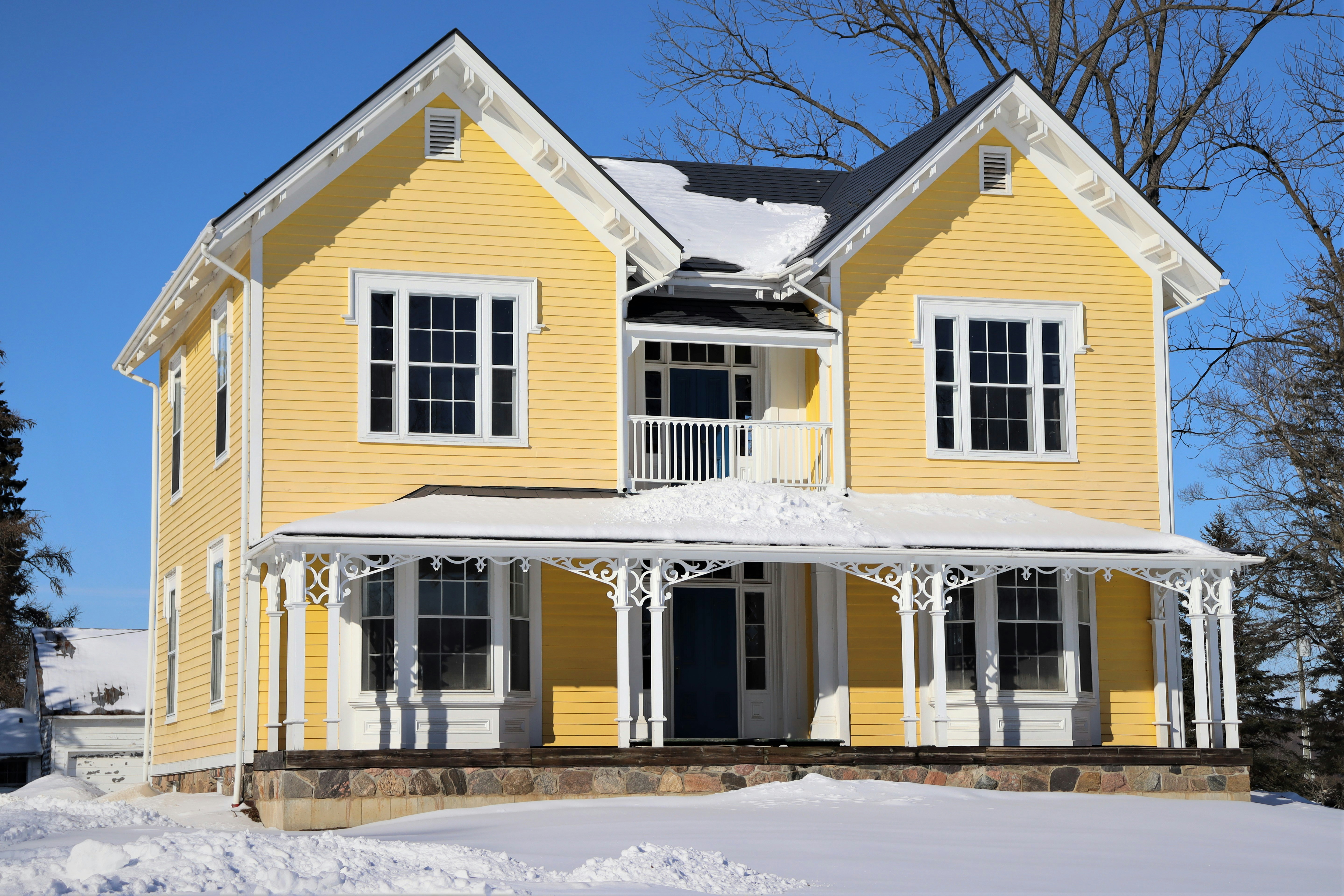A large yellow house with white trim and windows photo – Free Norfolk ...