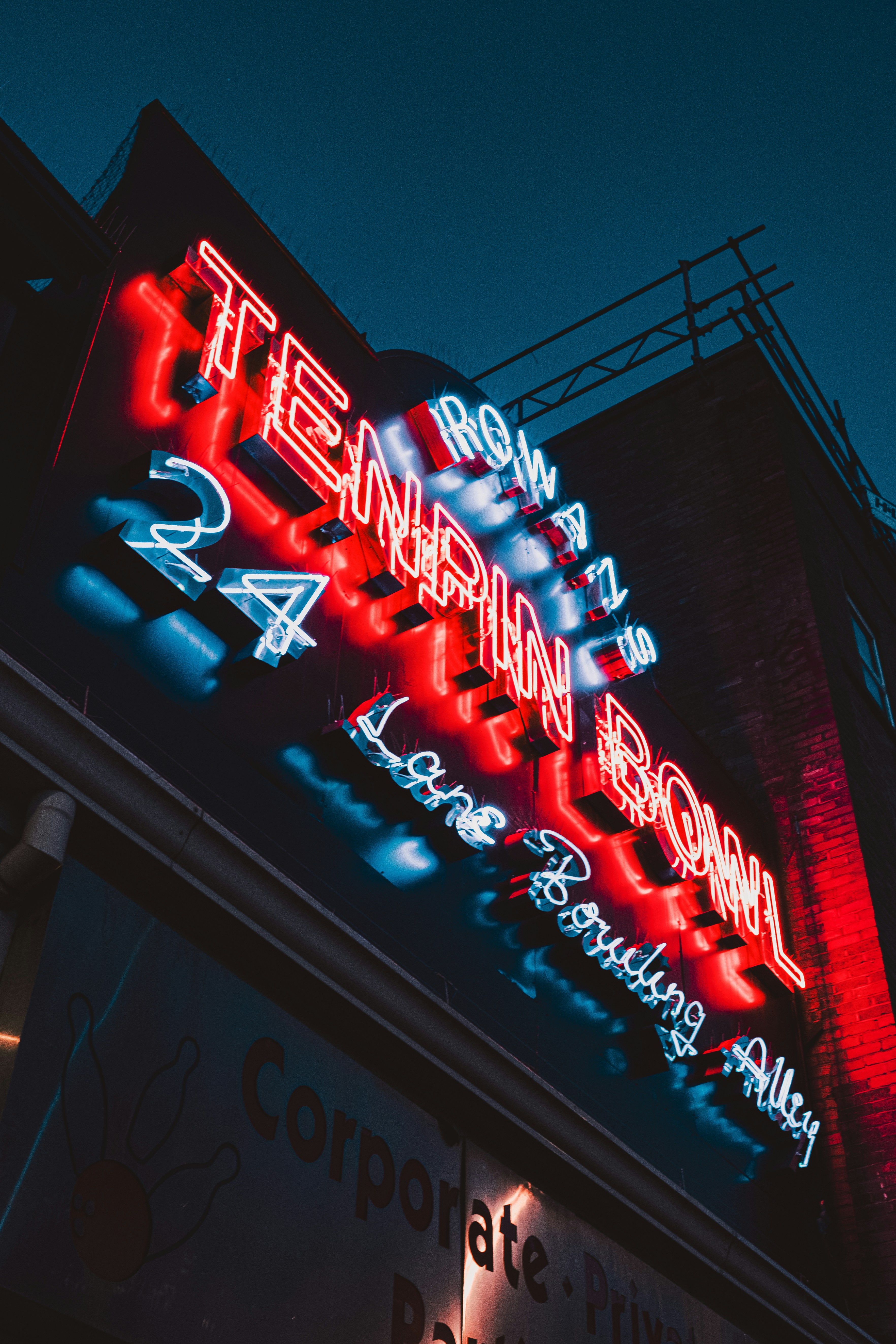 A neon sign on the side of a building photo – Free Finsbury park Image ...