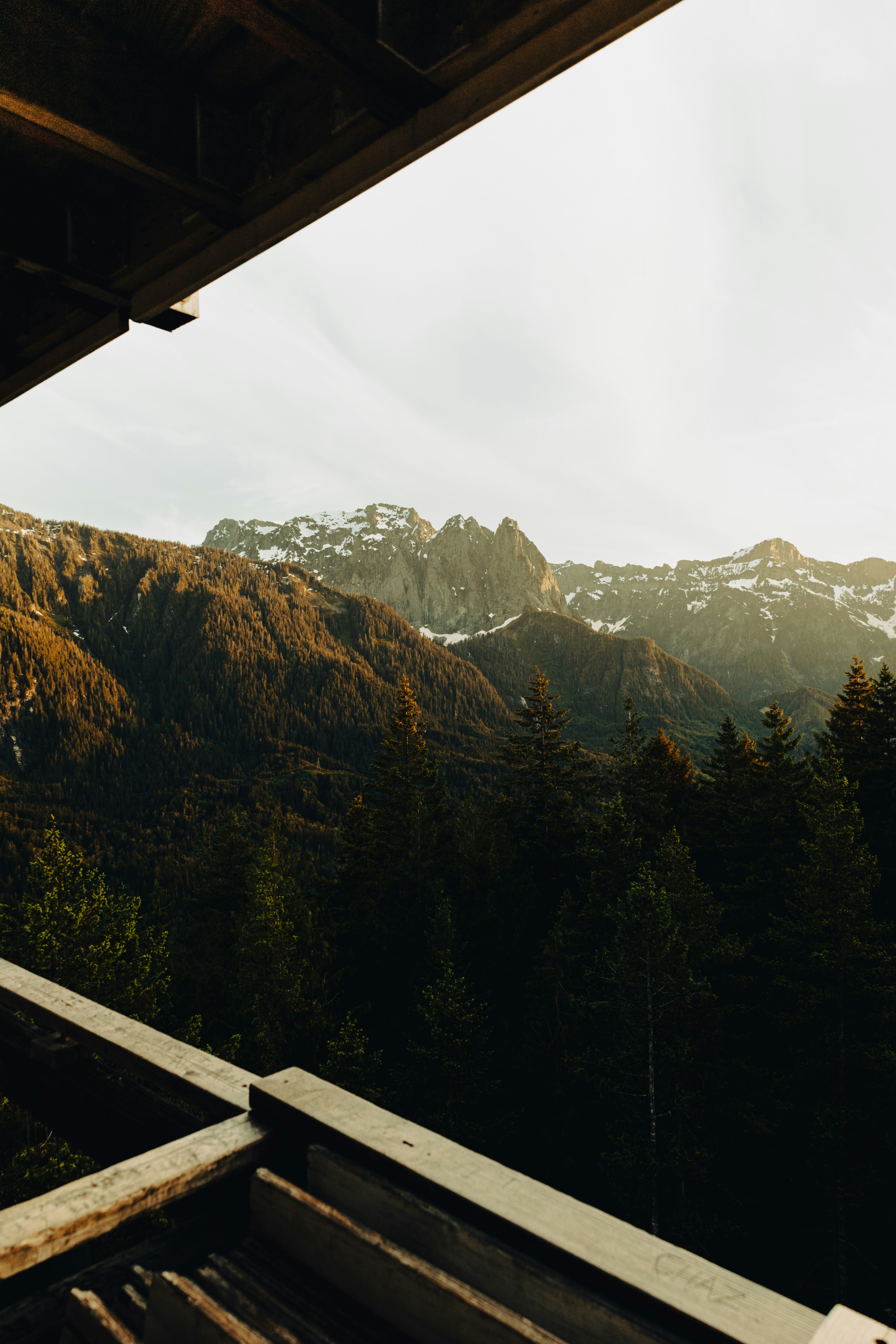 Rustic Veranda Overlook: Golden Light on a Mountain Ridge