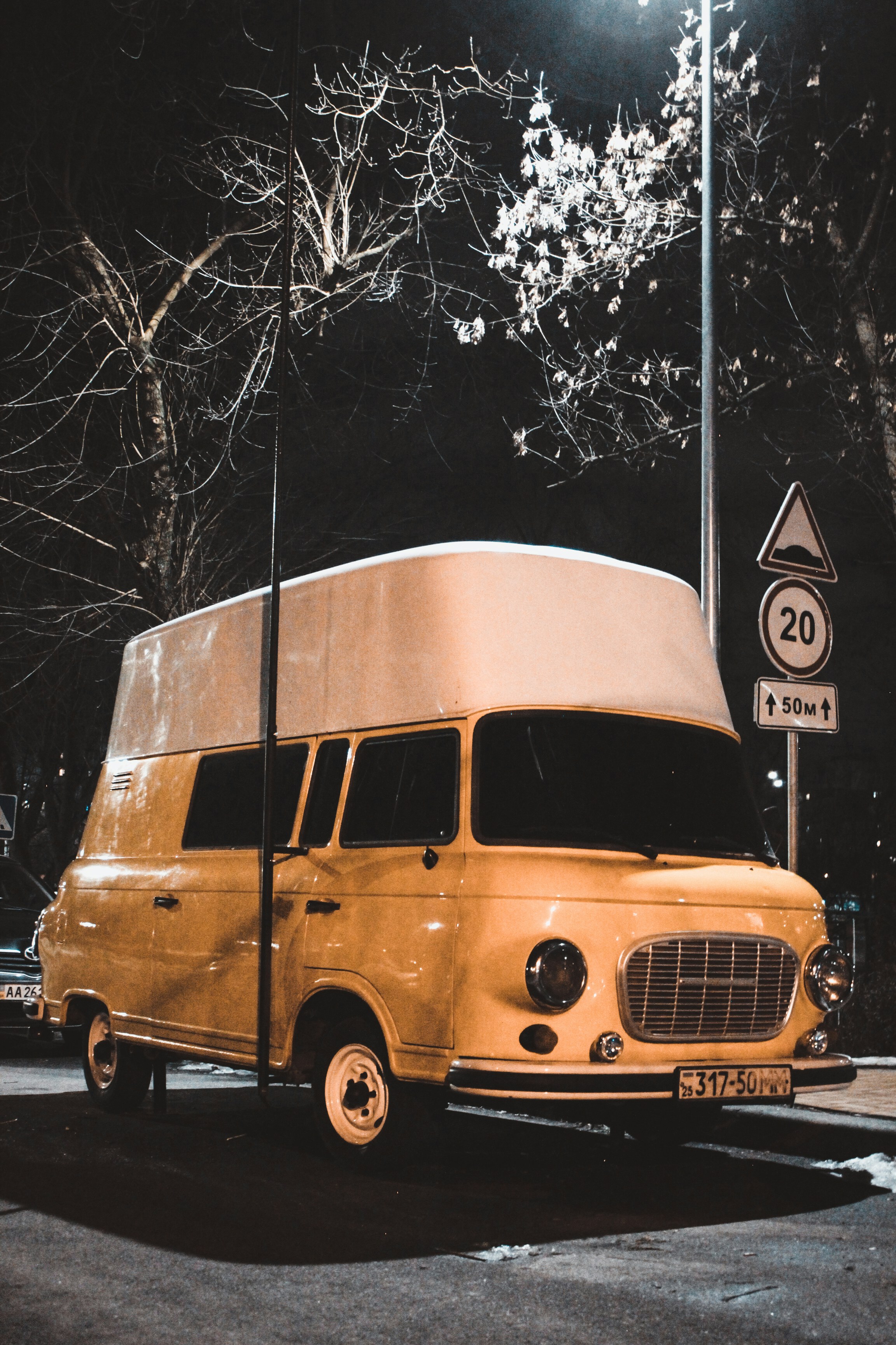 An old yellow bus parked on the side of the road photo – Free Парк ...