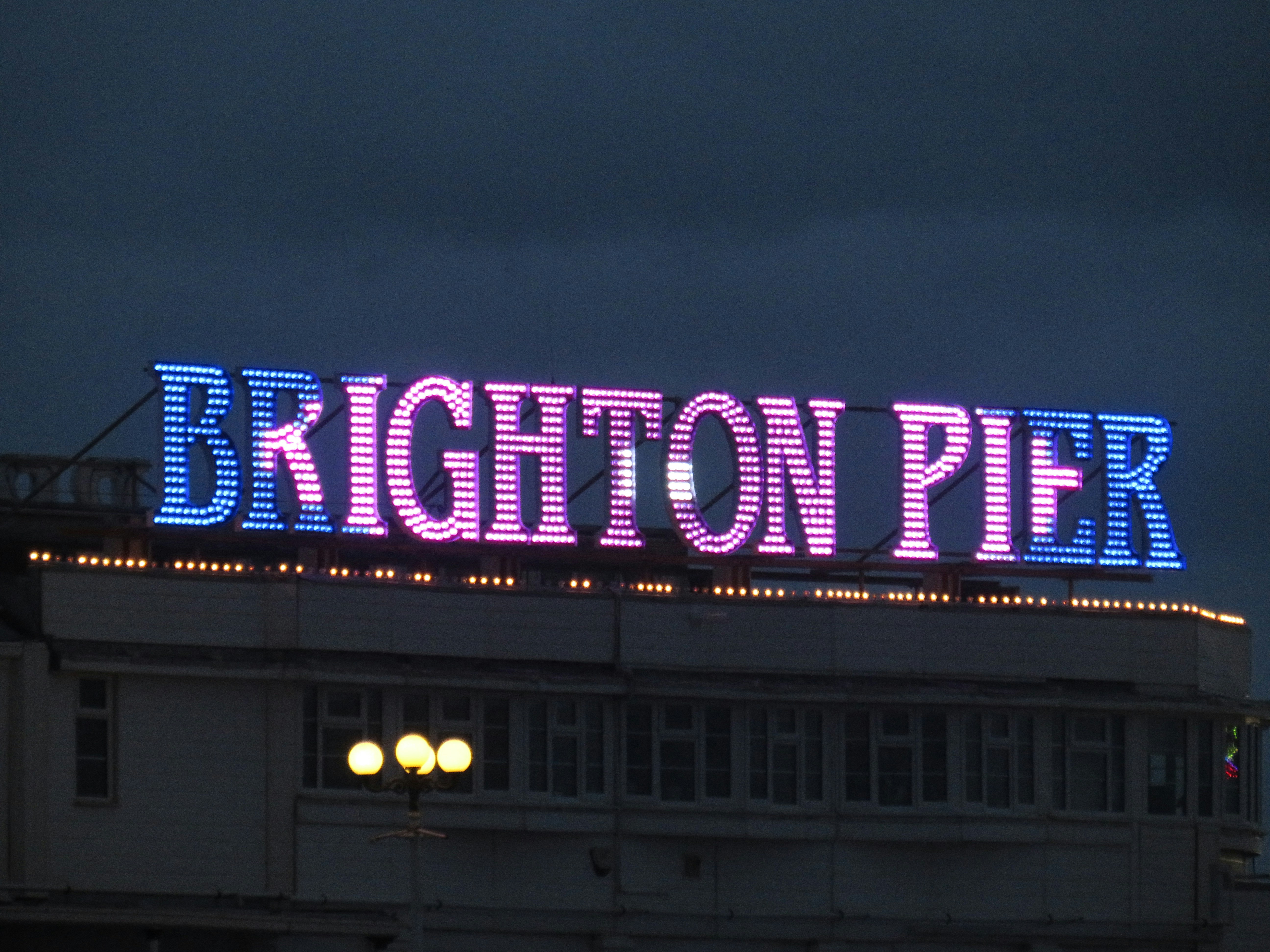Brighton Pier Neon Sign at Dusk