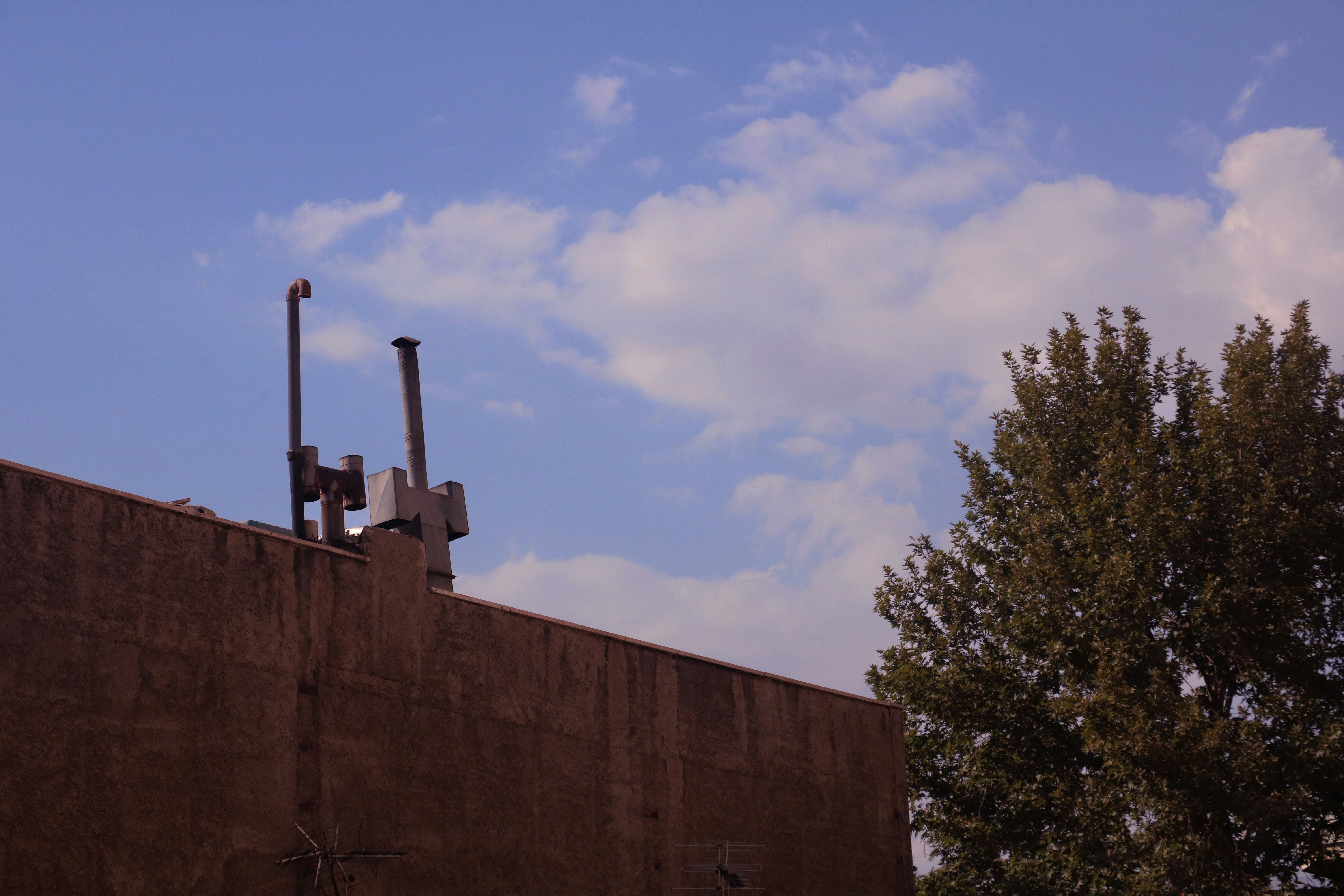 Rooftop Machinery Against a Quiet Sky