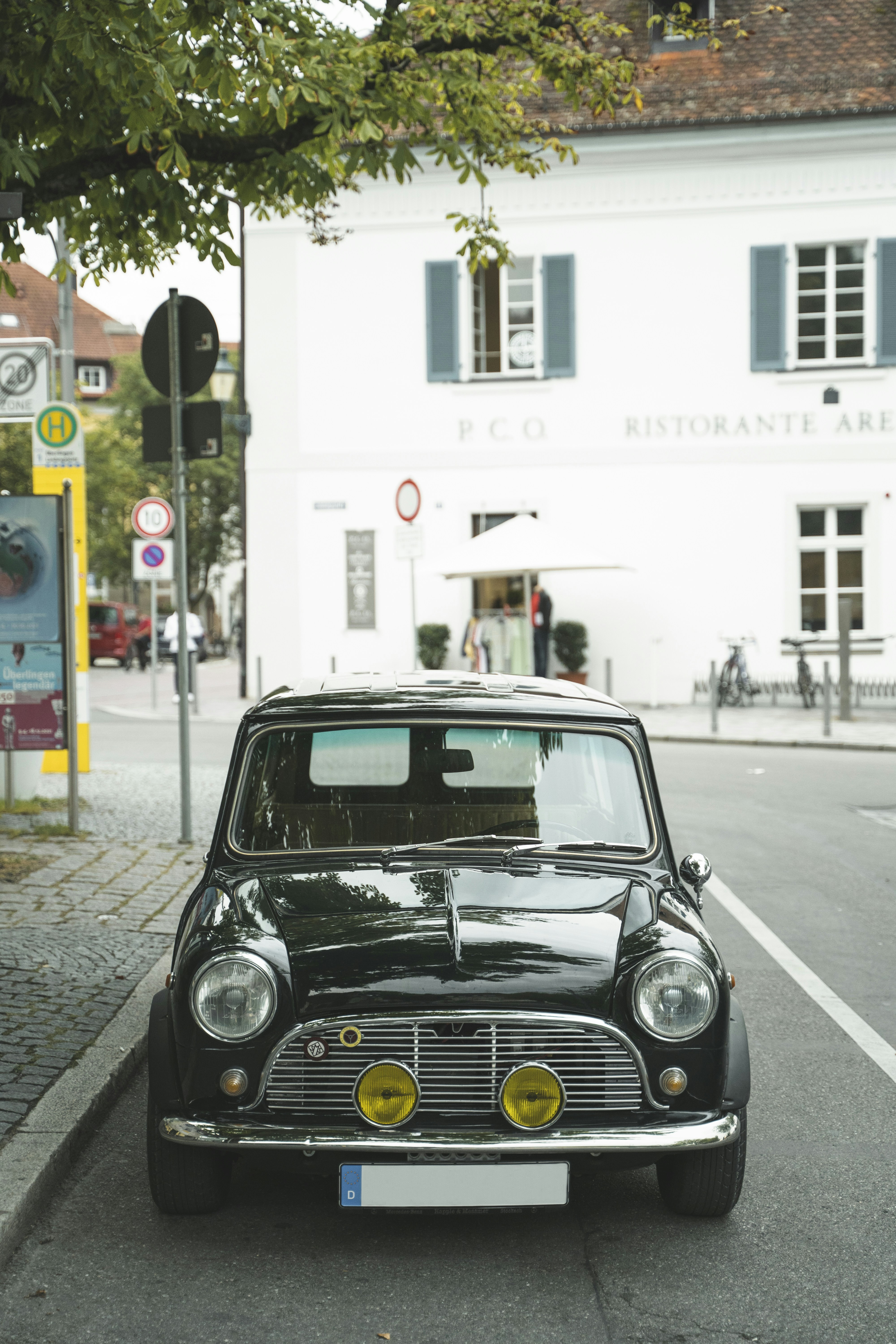 a black car parked on the side of the road