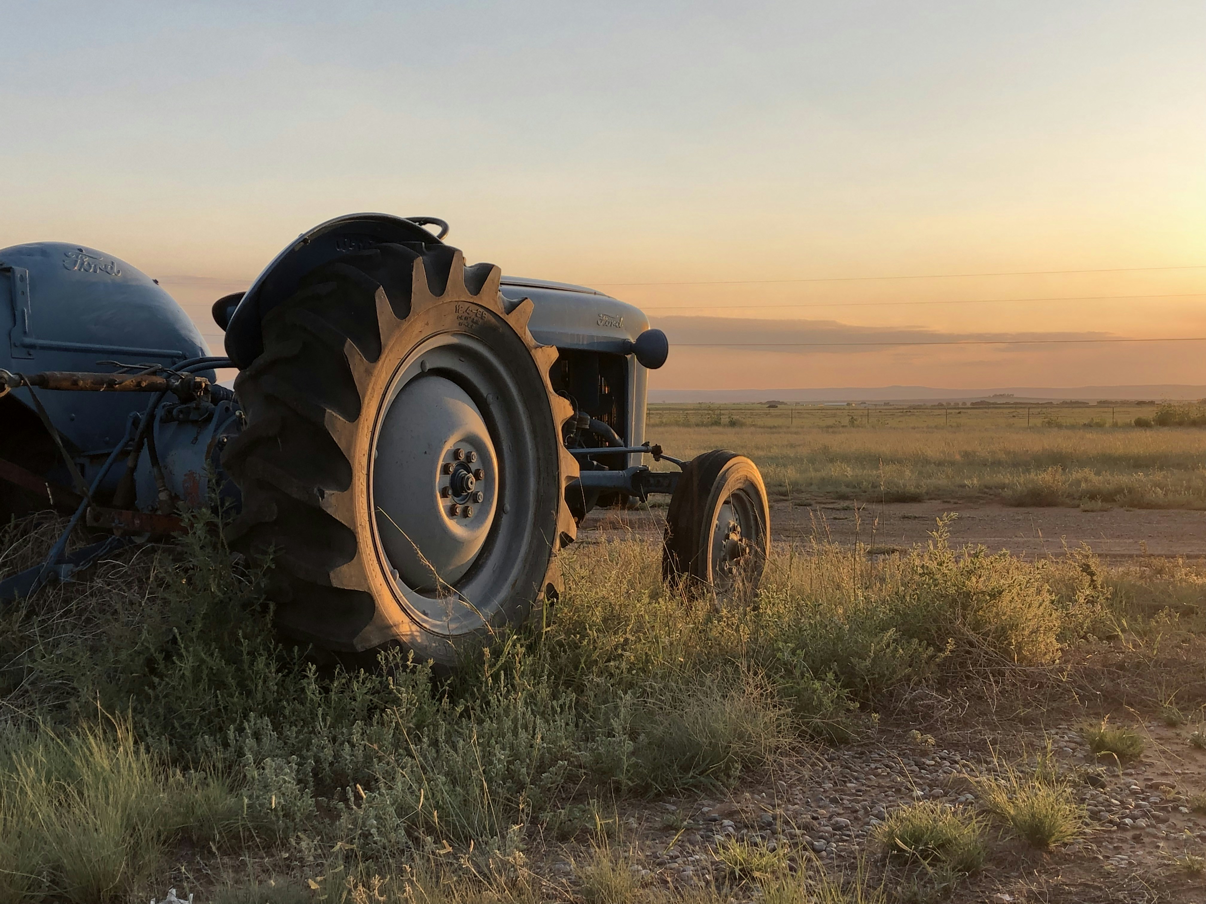 Sunset on the Field: A Tractor at Rest