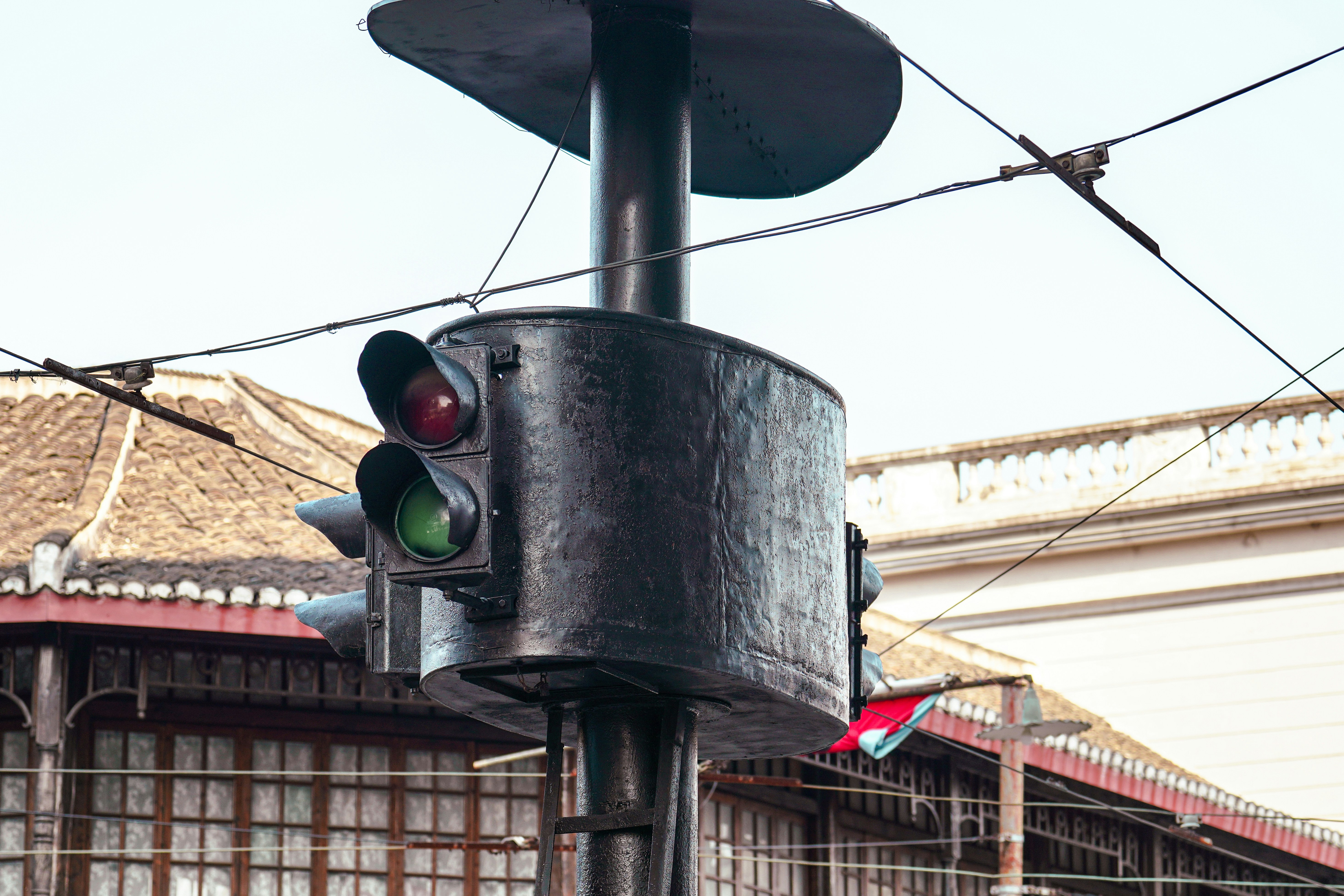 A traffic light hanging from a metal pole photo – Free Grey Image on ...