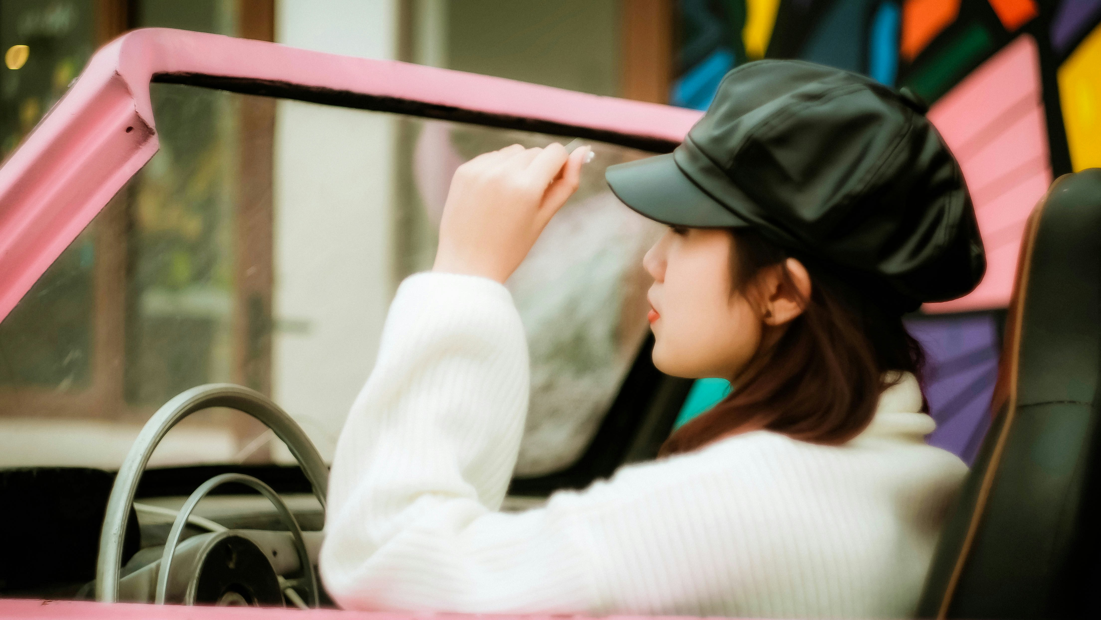 Soft Focus in a Convertible Moment: A Woman with a Cap