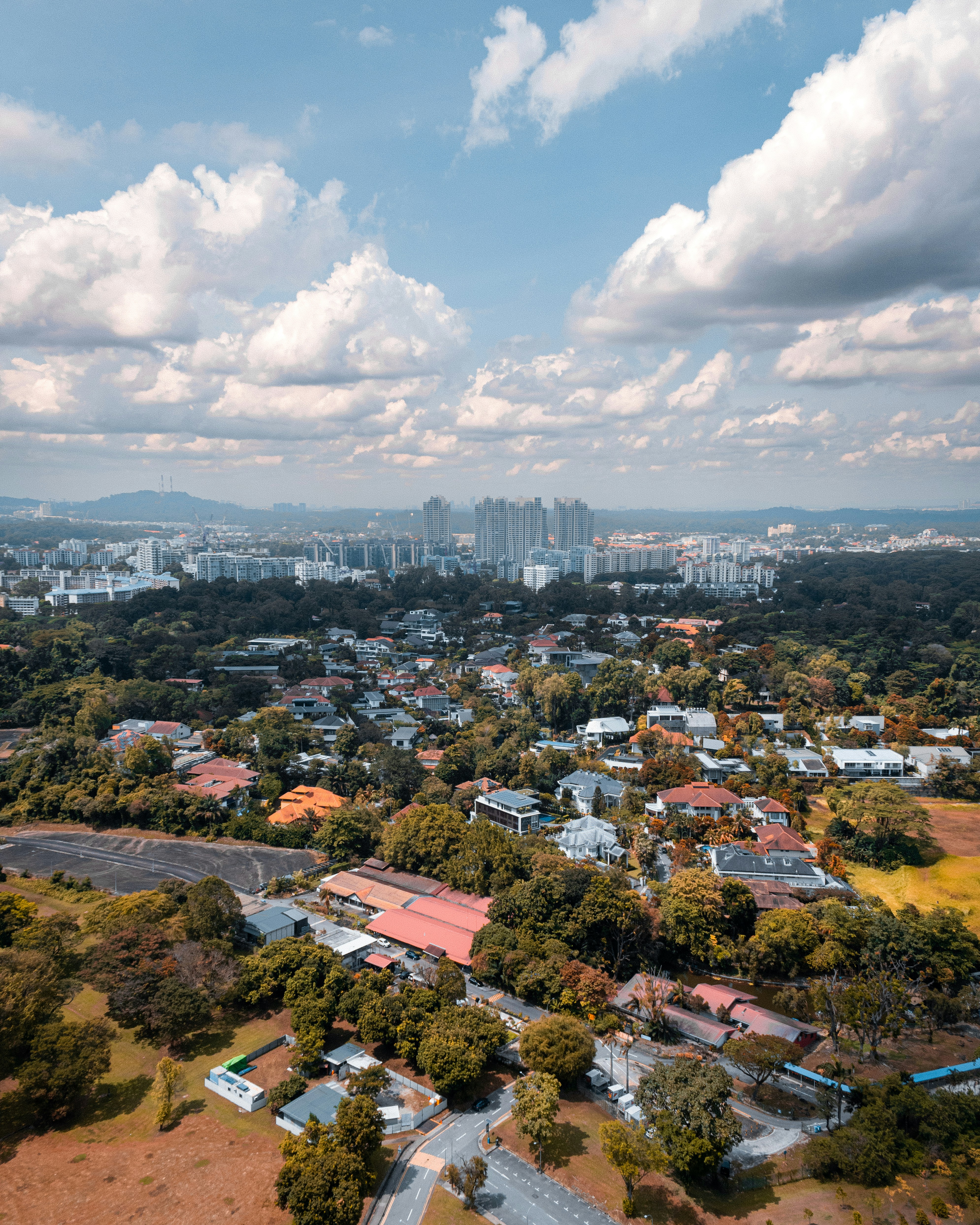 an aerial view of a city with lots of trees