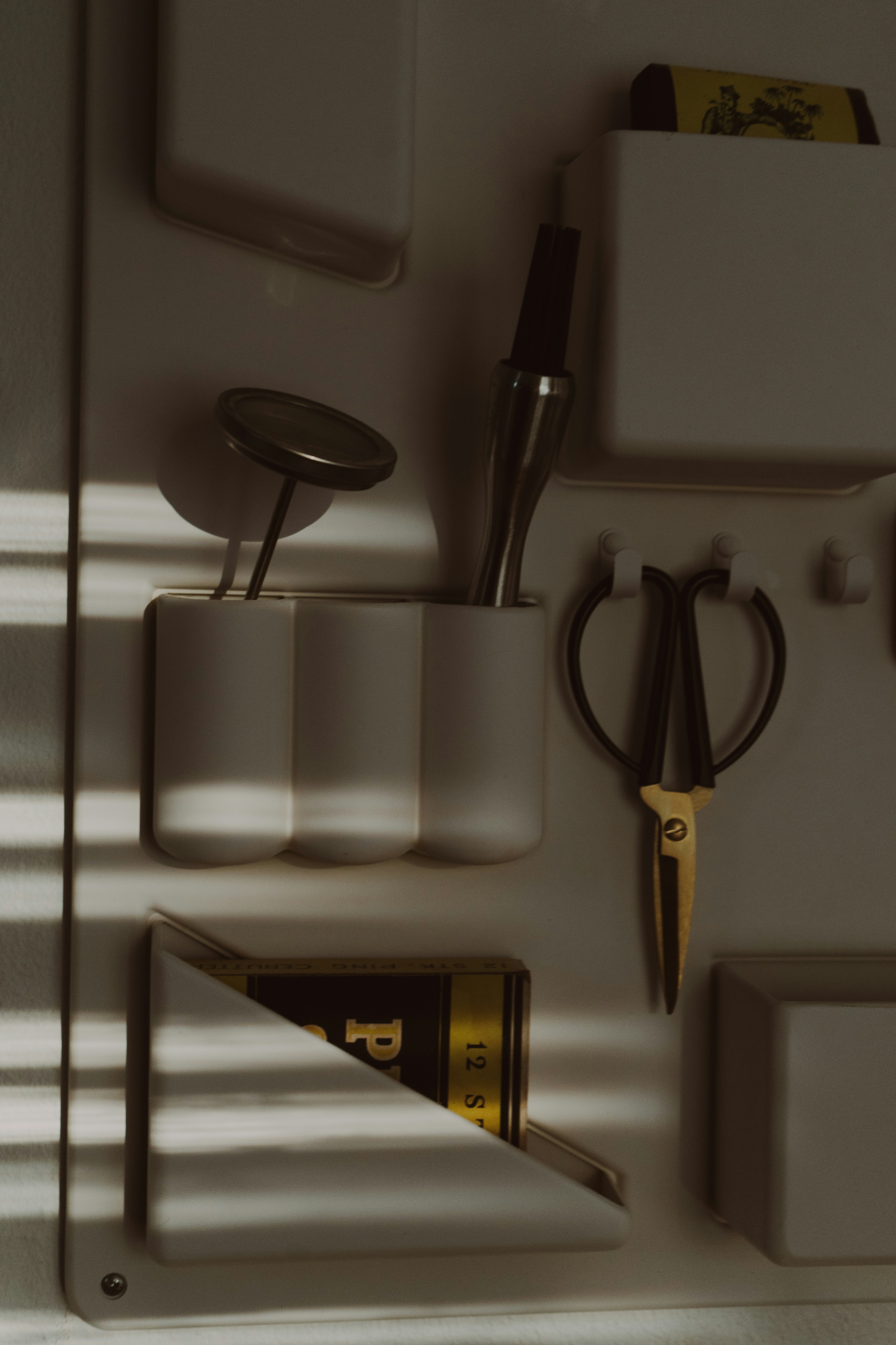 A pair of scissors and a pair of scissors on a shelf photo – Free ...