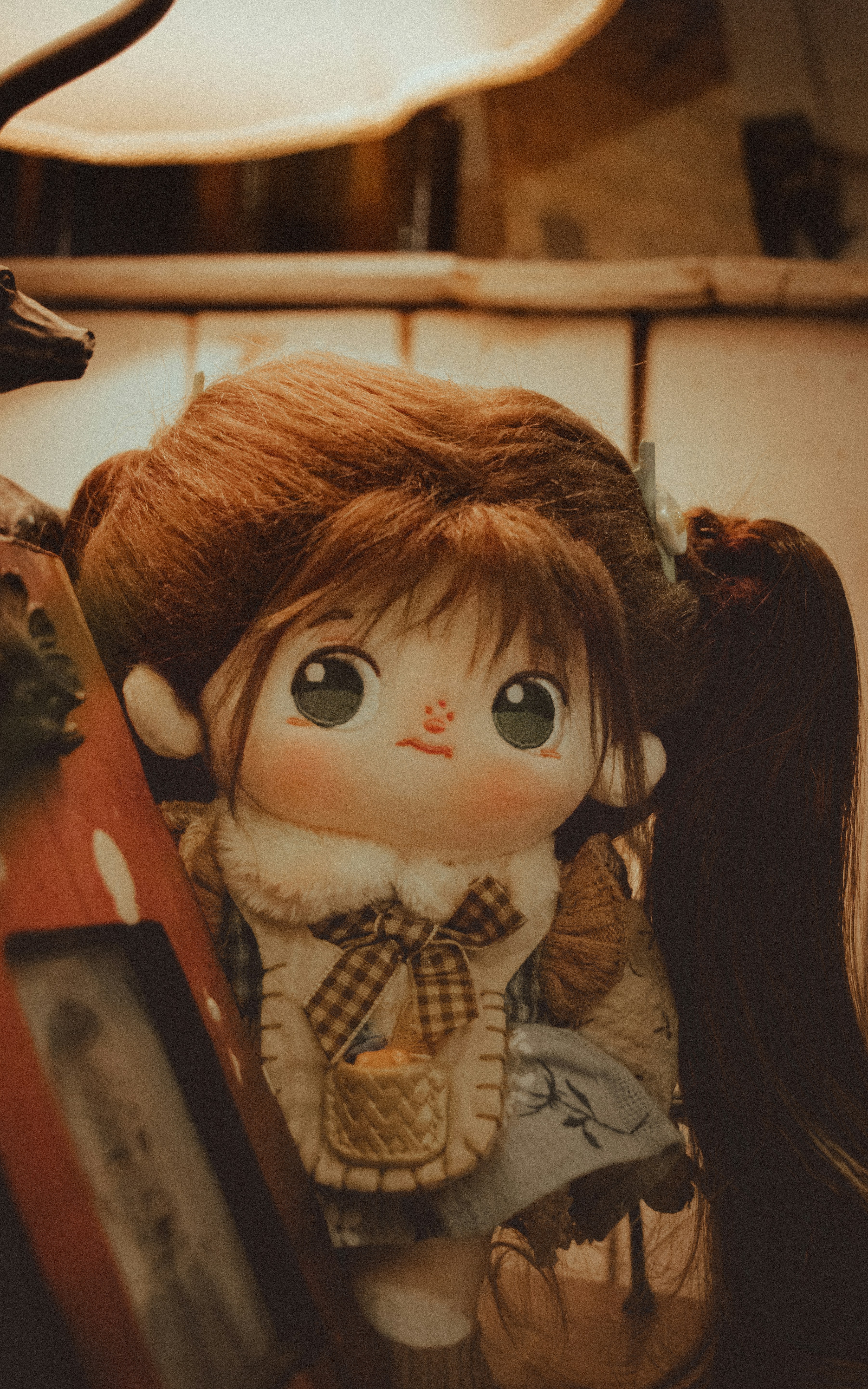 A charming doll with large eyes and a cozy outfit, surrounded by nostalgic decor elements. The warm lighting enhances the doll's playful expression.