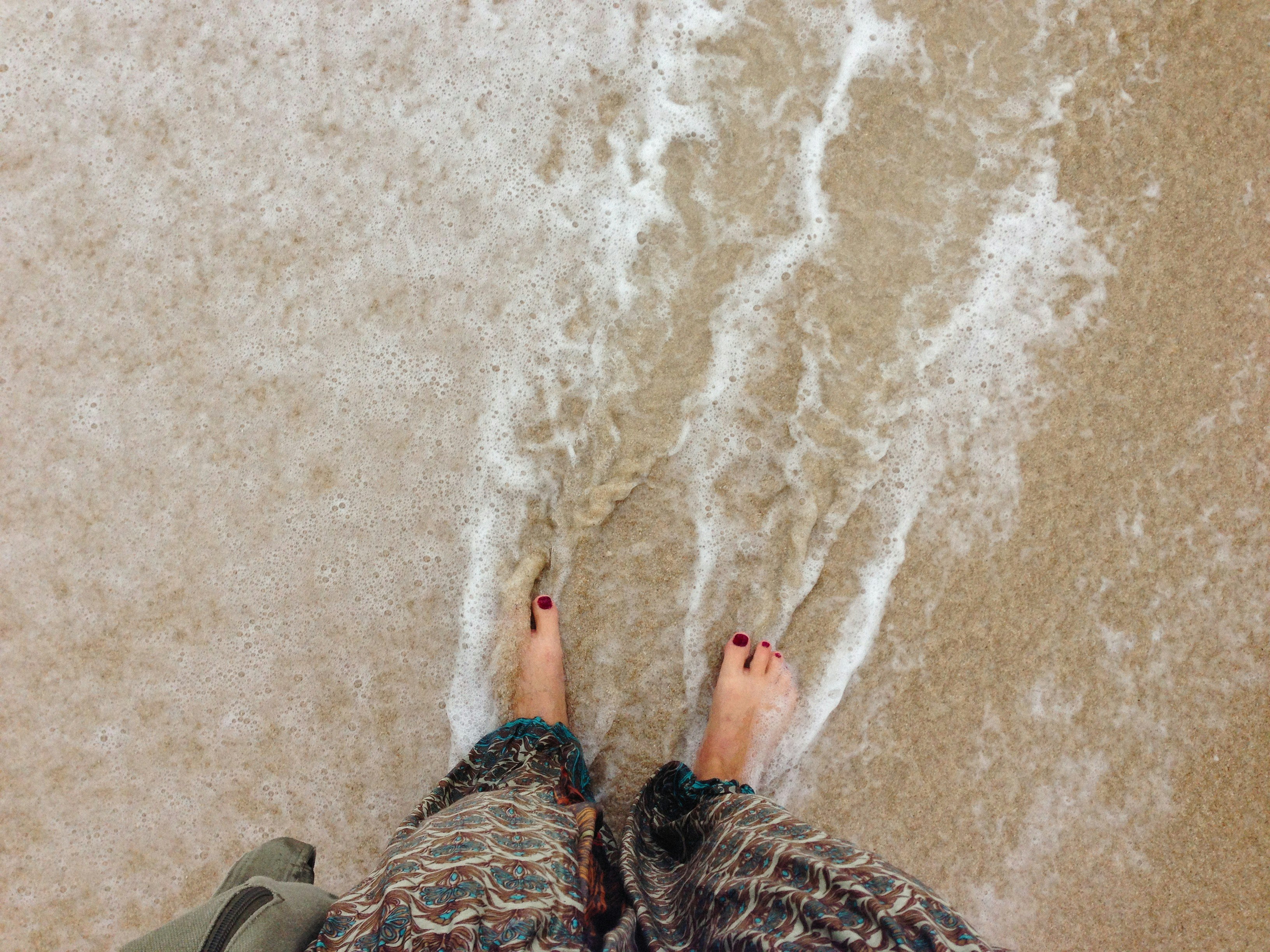 Barefoot at the Verge: Red Nails Meet the Sea