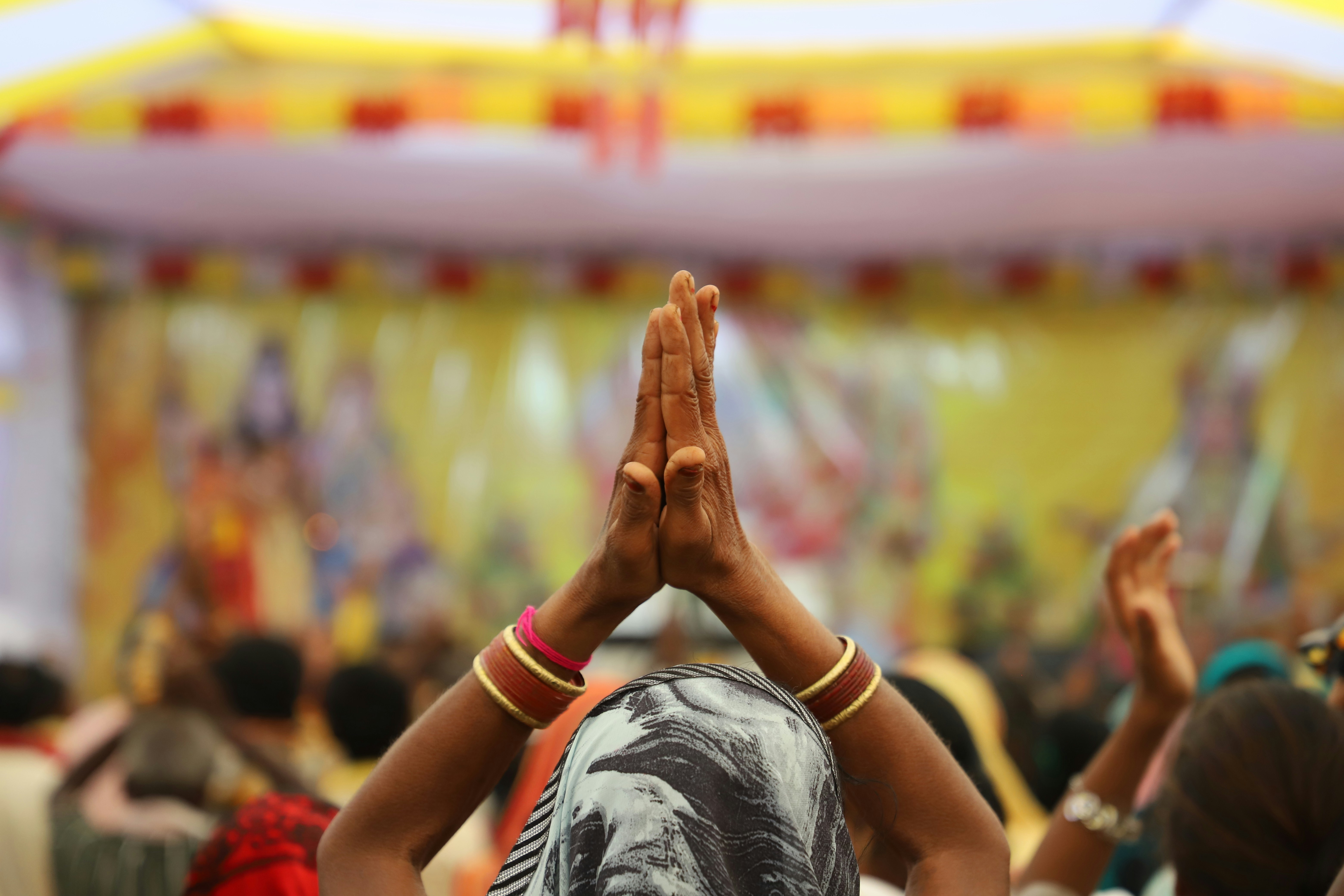 A group of people standing in front of a stage photo – Free Devotee ...