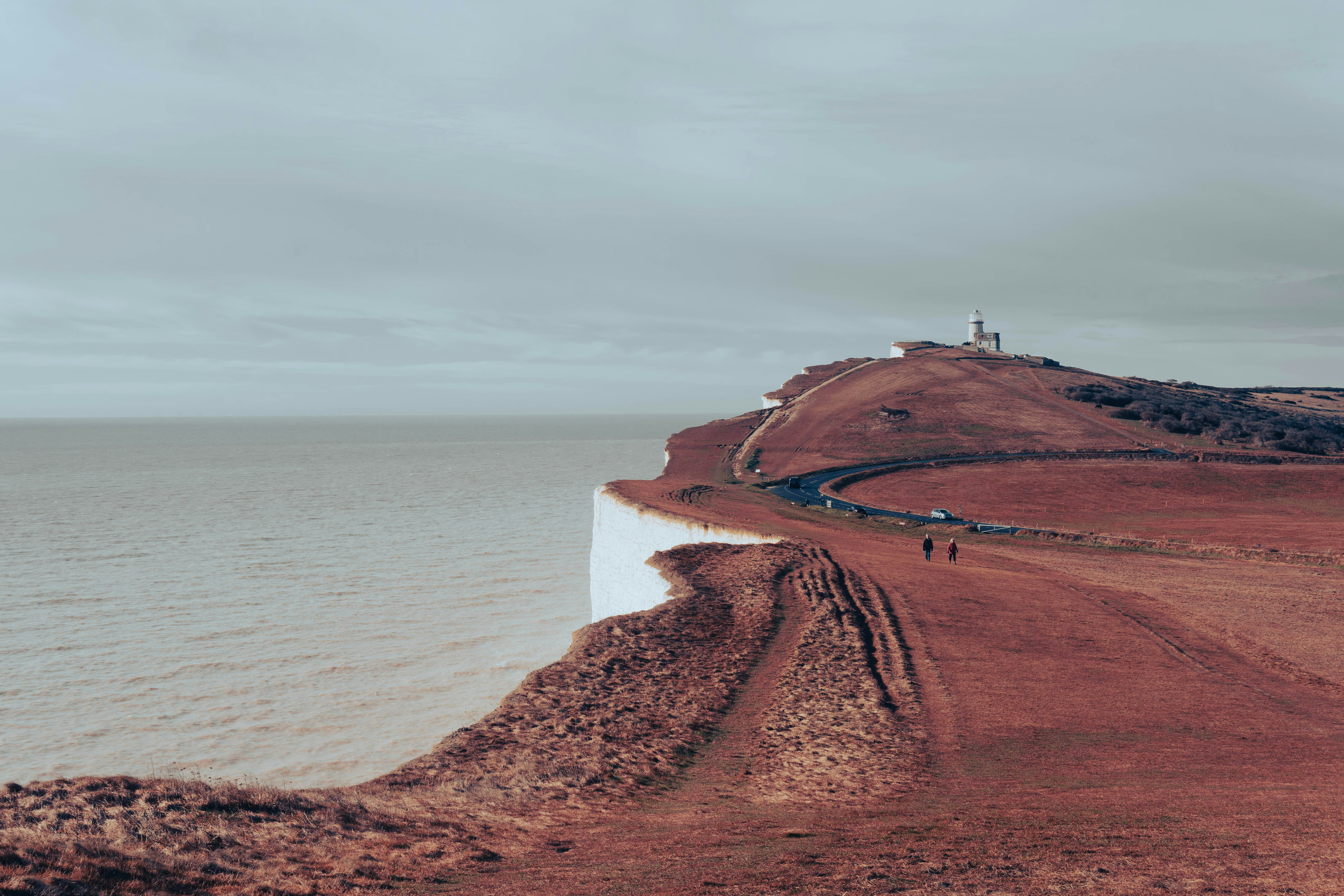 Lighthouse Crest: A Red Cliffs Path Along the Sea