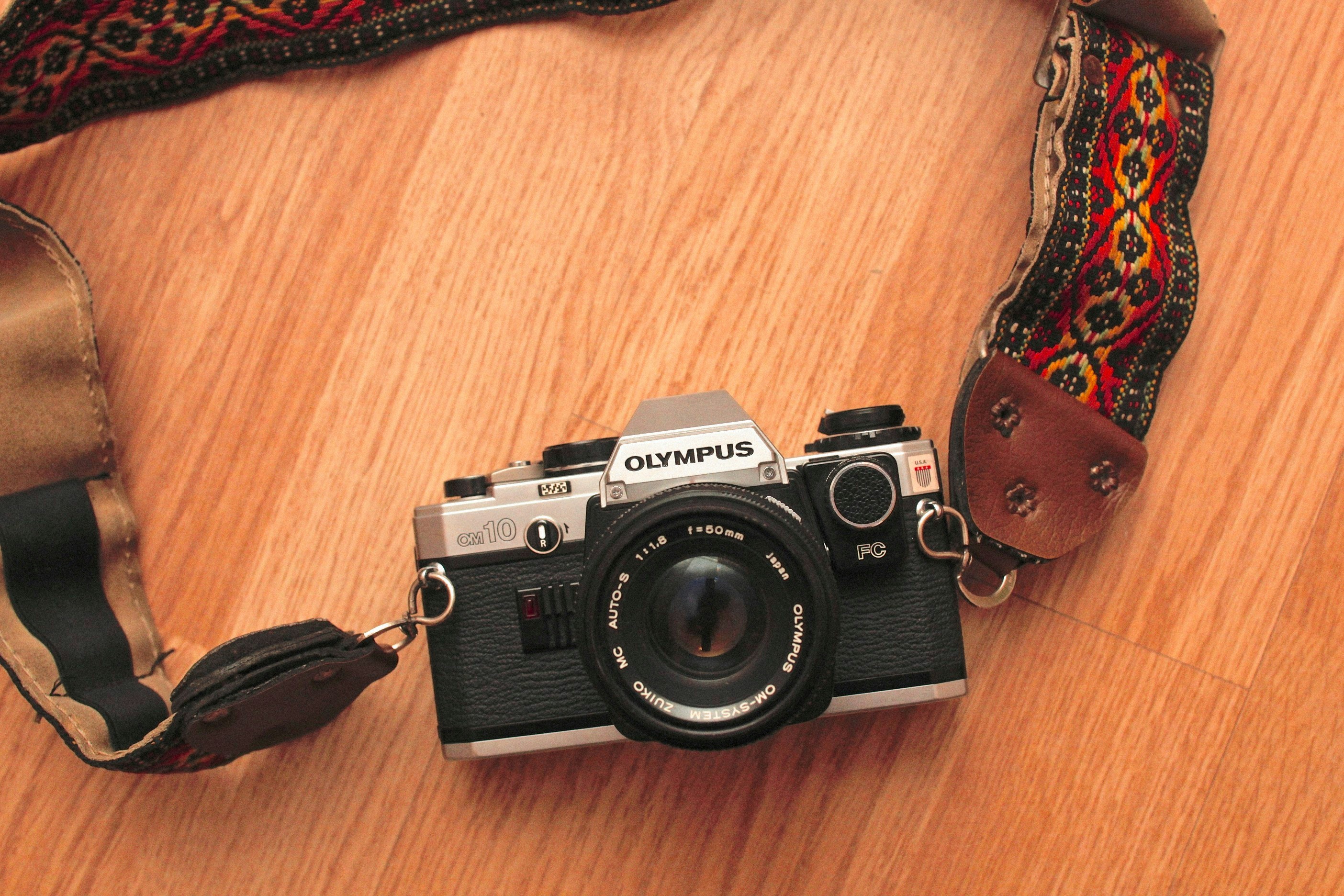 a camera with a strap attached to it