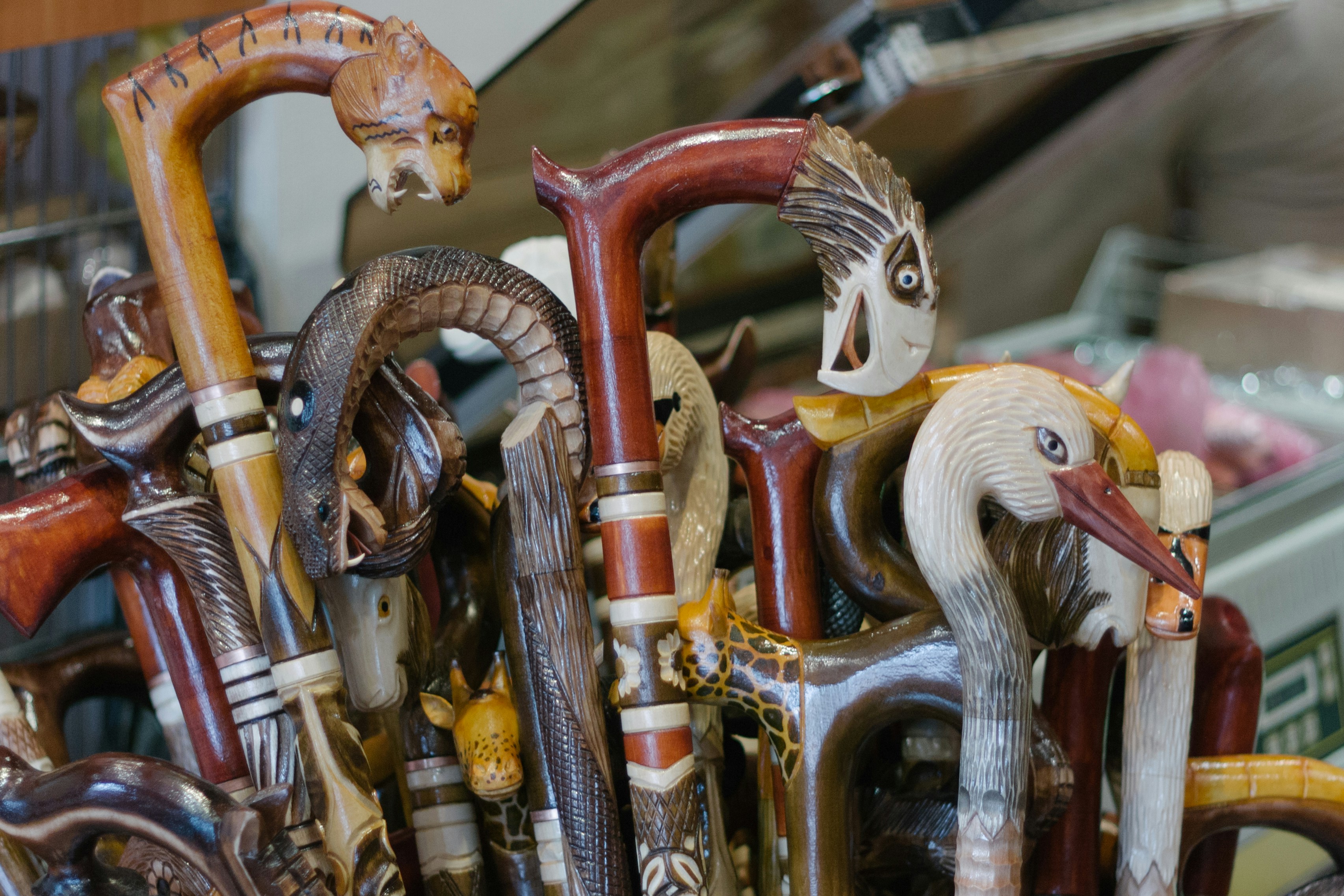 a pile of assorted carved wooden items
