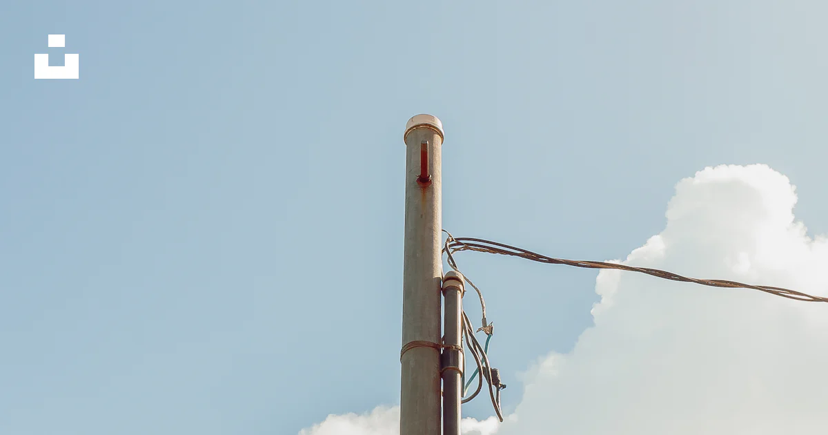 A Telephone Pole With A Sky In The Background Photo Free Clouds Image a-telephone-pole-with-a-sky-in-the-background-photo-free-clouds-image