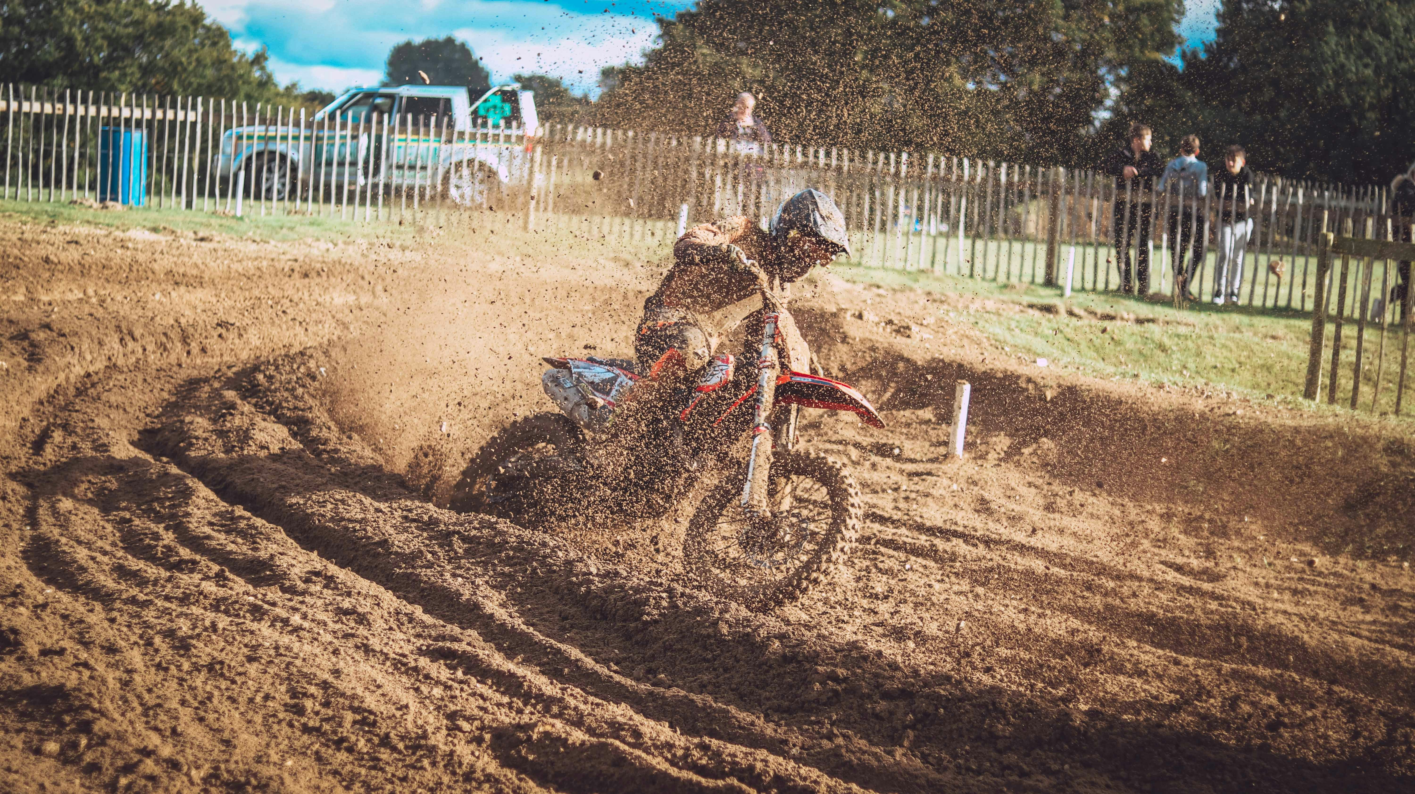 A person riding a dirt bike on a dirt track photo – Free Cadders hill ...