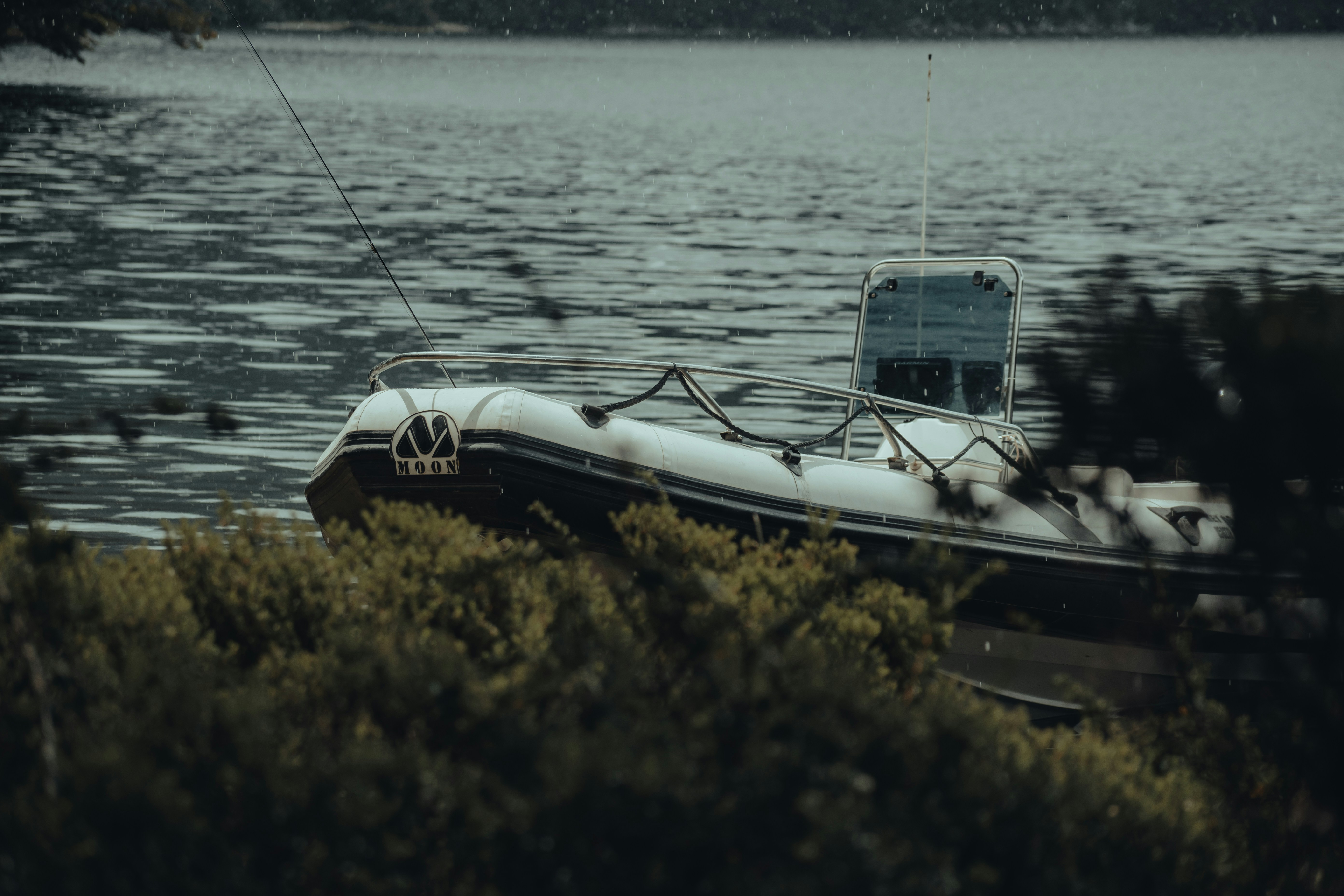 Edge of Calm: A Compact Inflatable Boat Resting by a Quiet Lakeshore