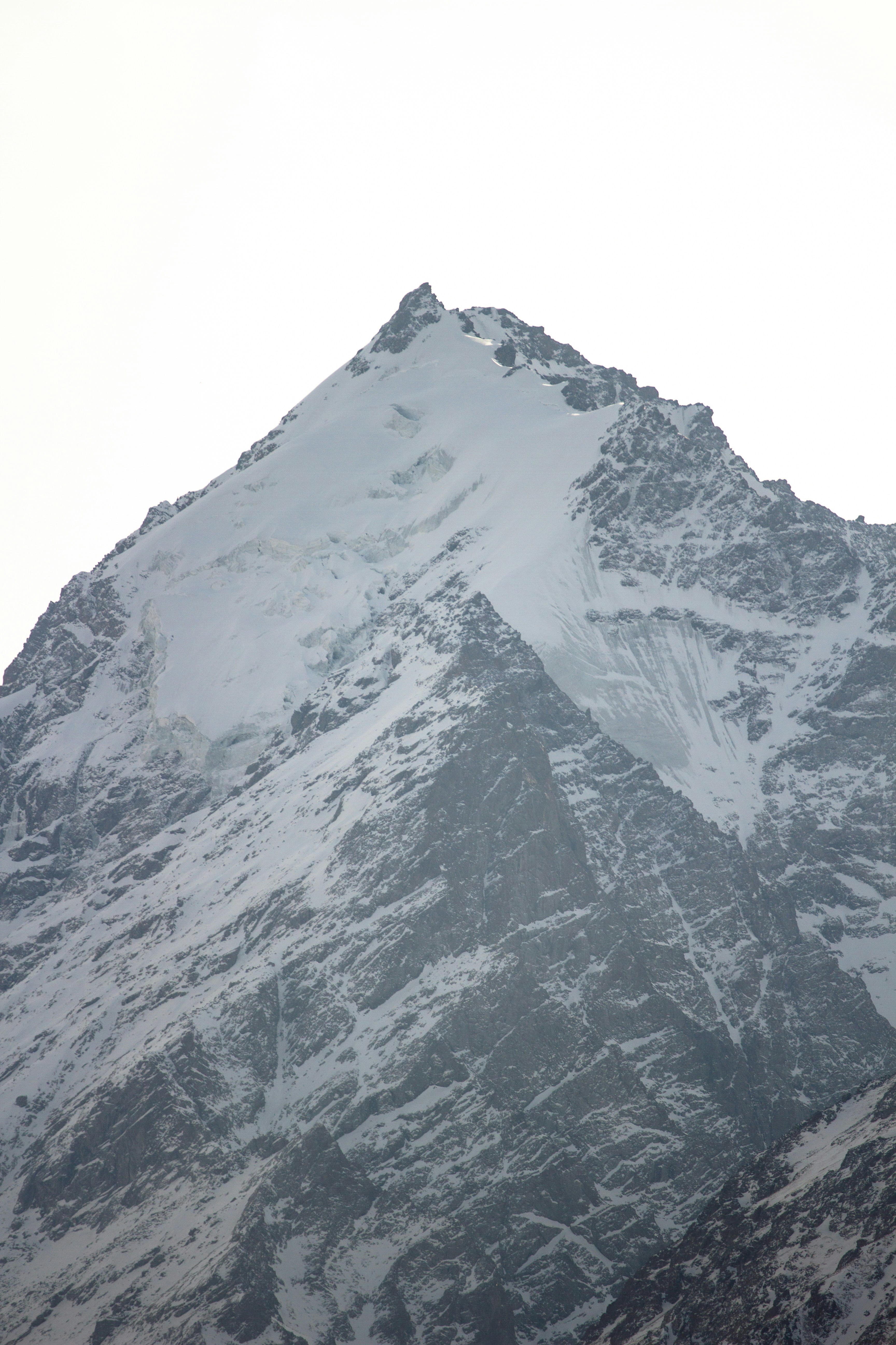 Ice Crown on the Northern Peak Under a Bleached Sky