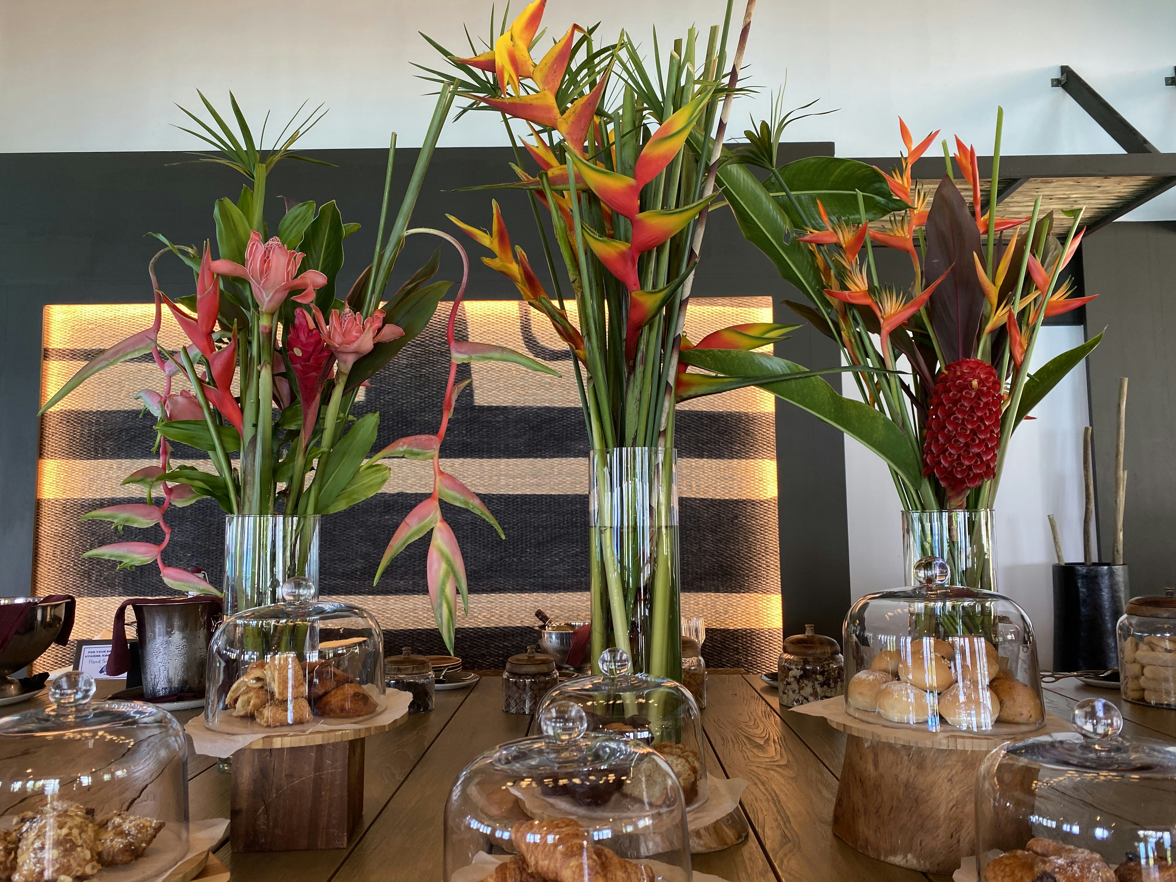 Floral Centerpiece Array: Glass Vases and Wooden Platforms