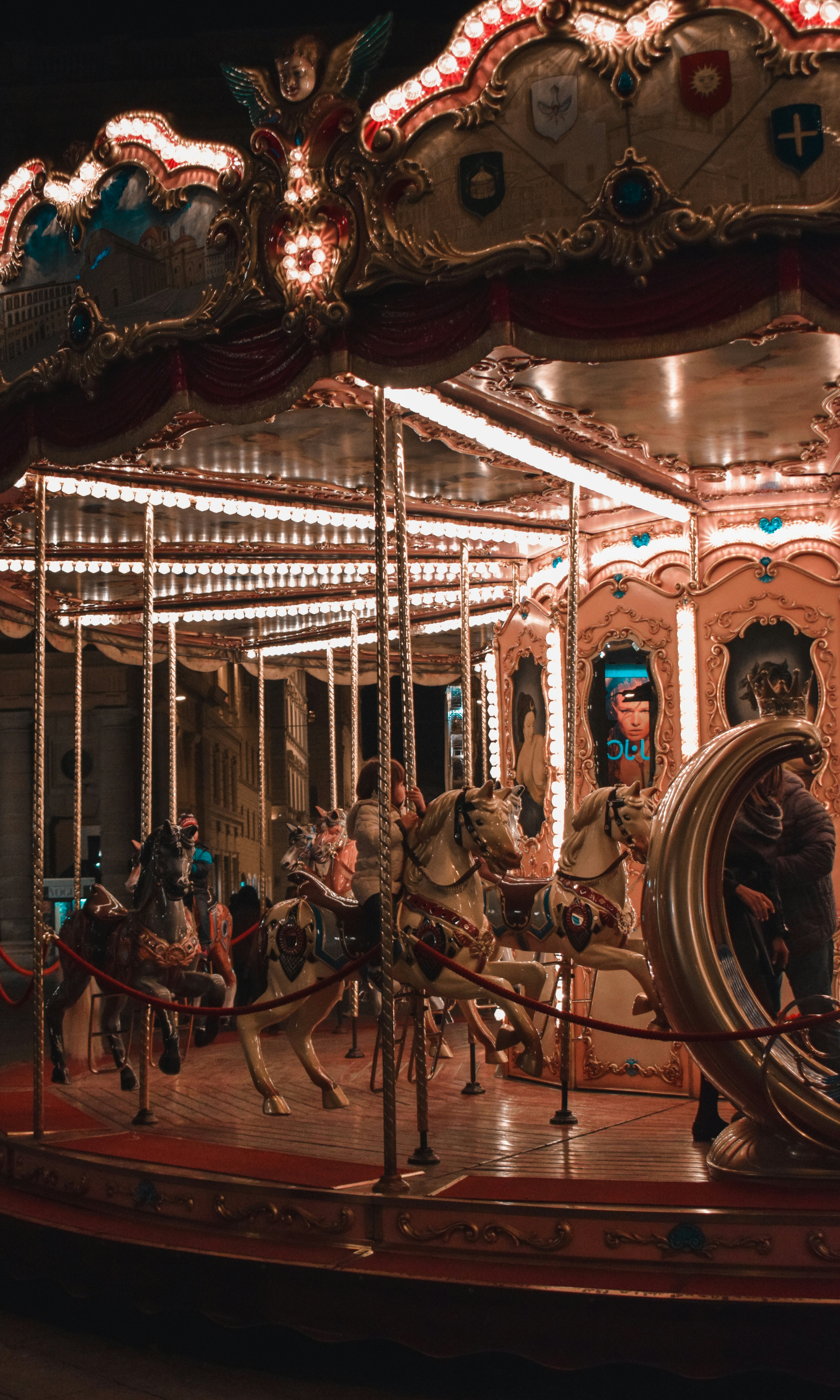 A merry go round with people riding on it photo – Free Firenze Image on ...