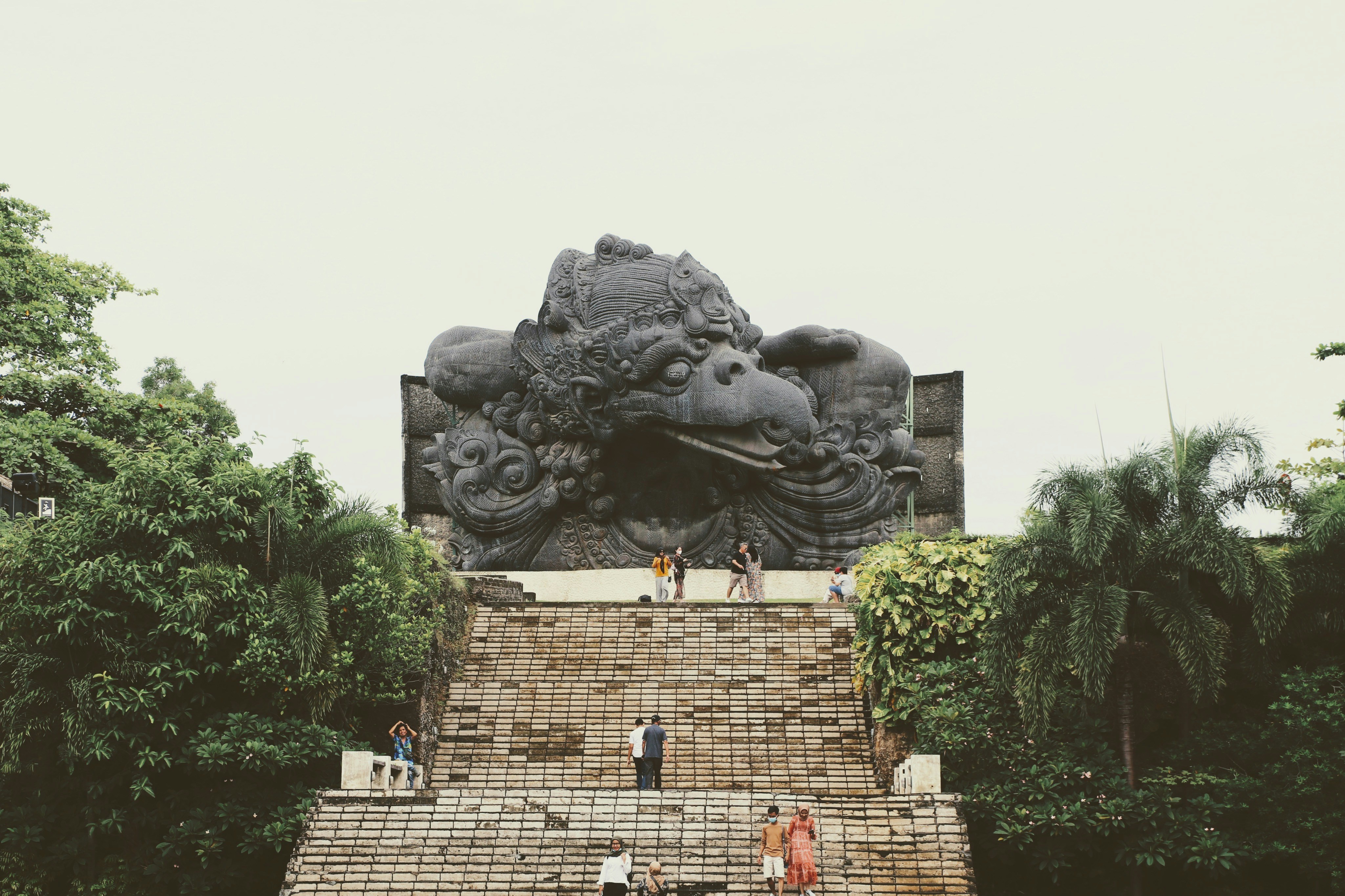 Staircase to the Dragon's Gaze: A Quiet Summit Beneath a Monumental Head