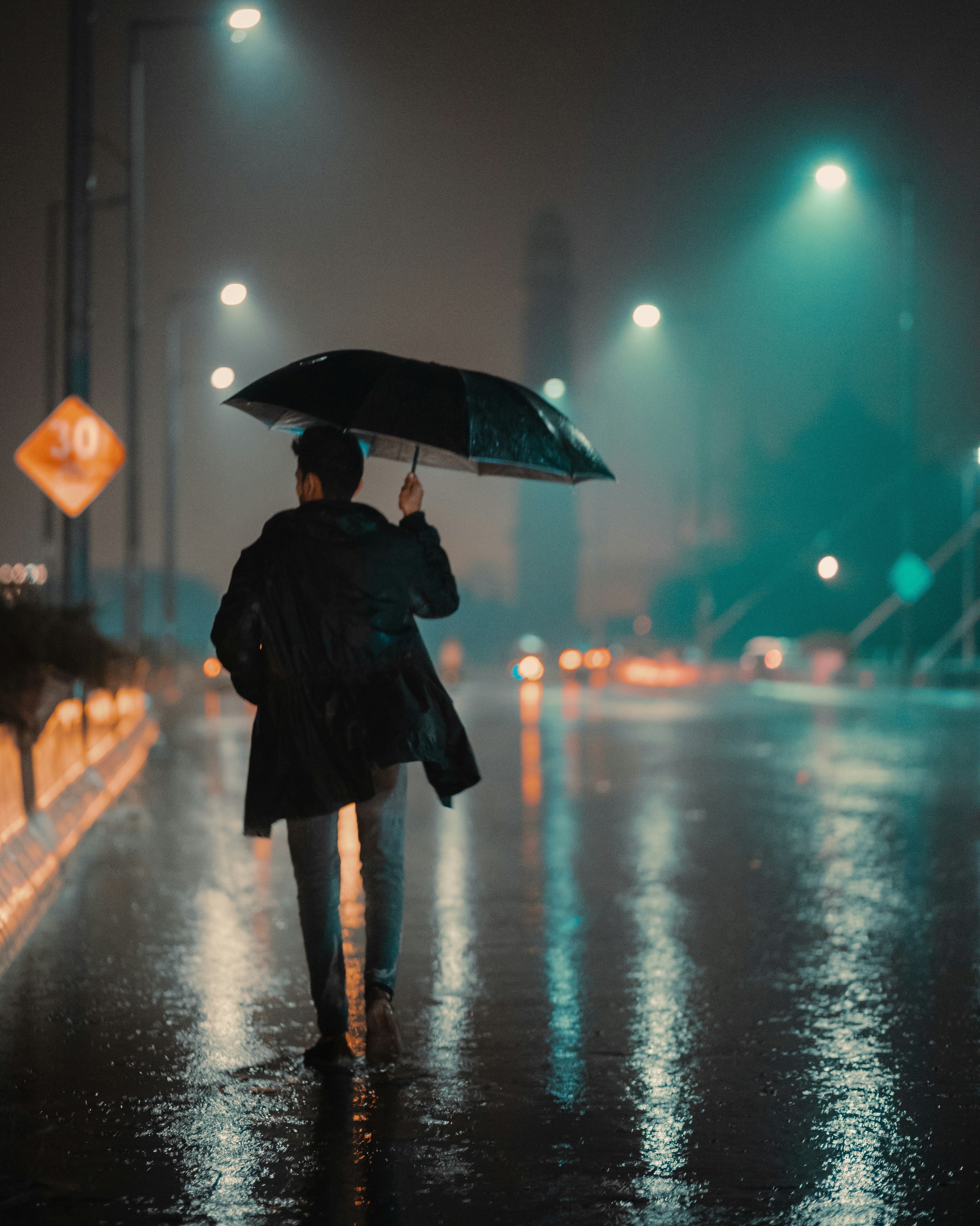 Lonely Boy Walking In Rain Wallpaper